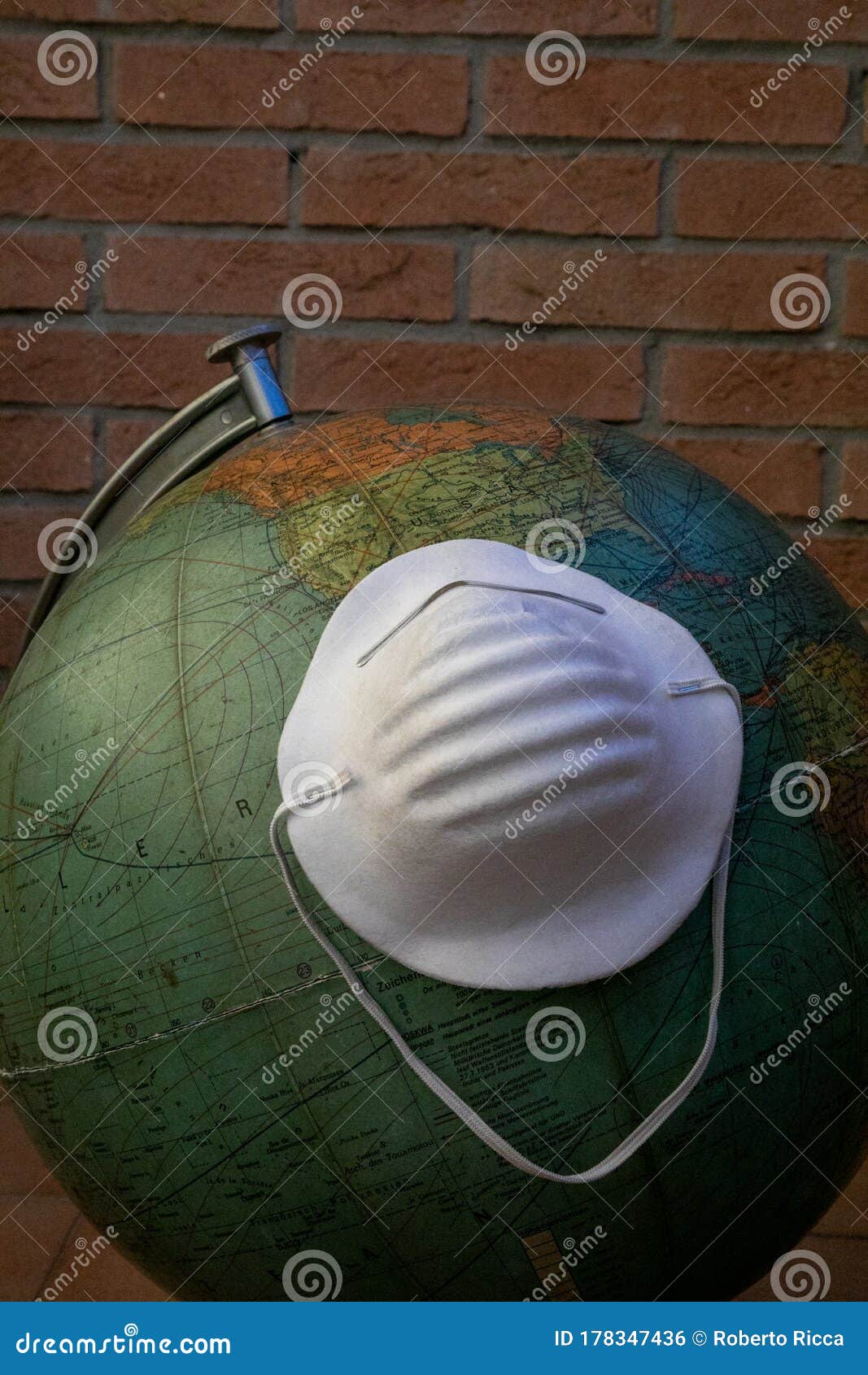 Globe Earth with Mask Protection Against Coronavirus Stock Photo ...