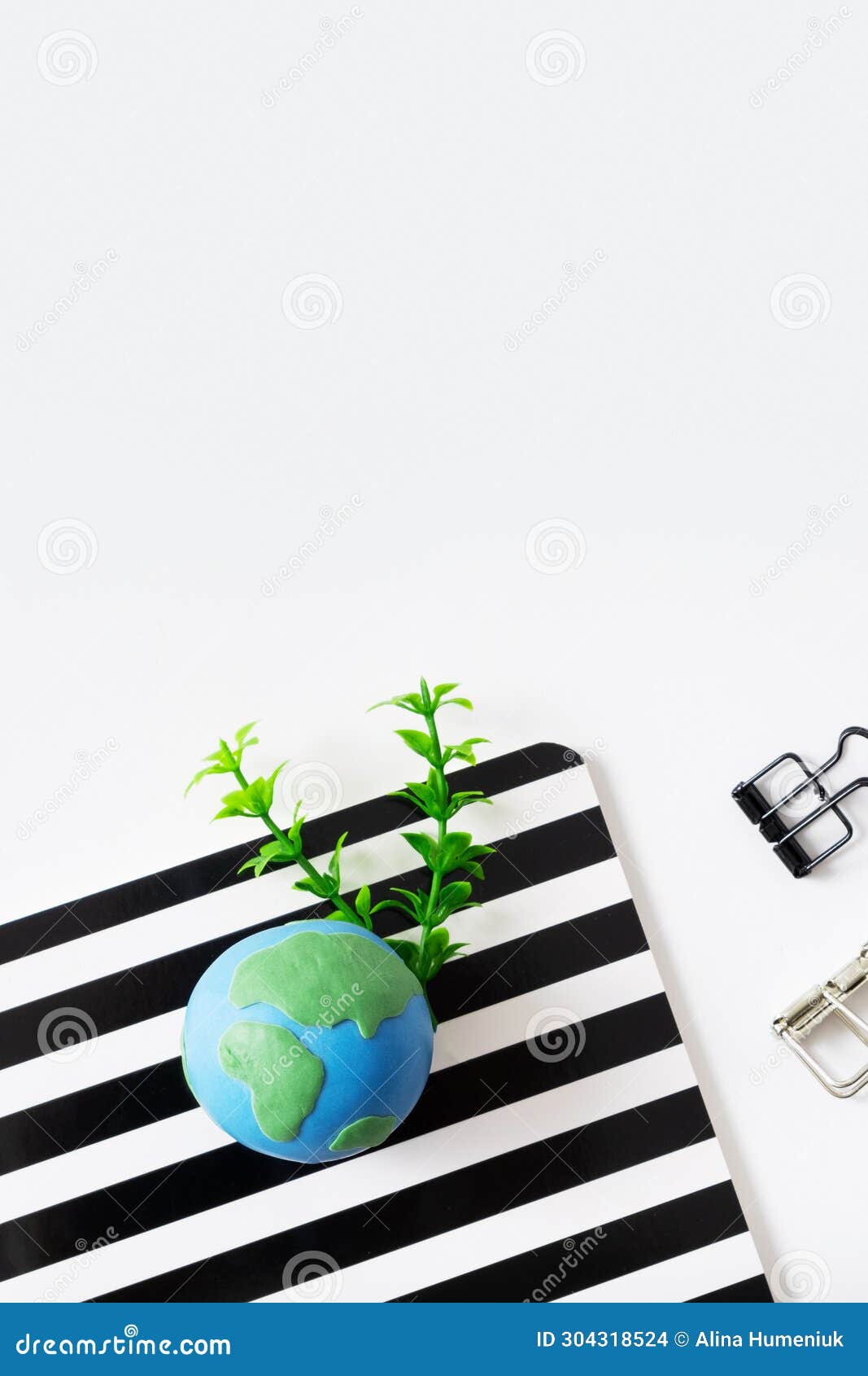 Globe with Green Leaves on Notepad. World Environmental Education Day ...