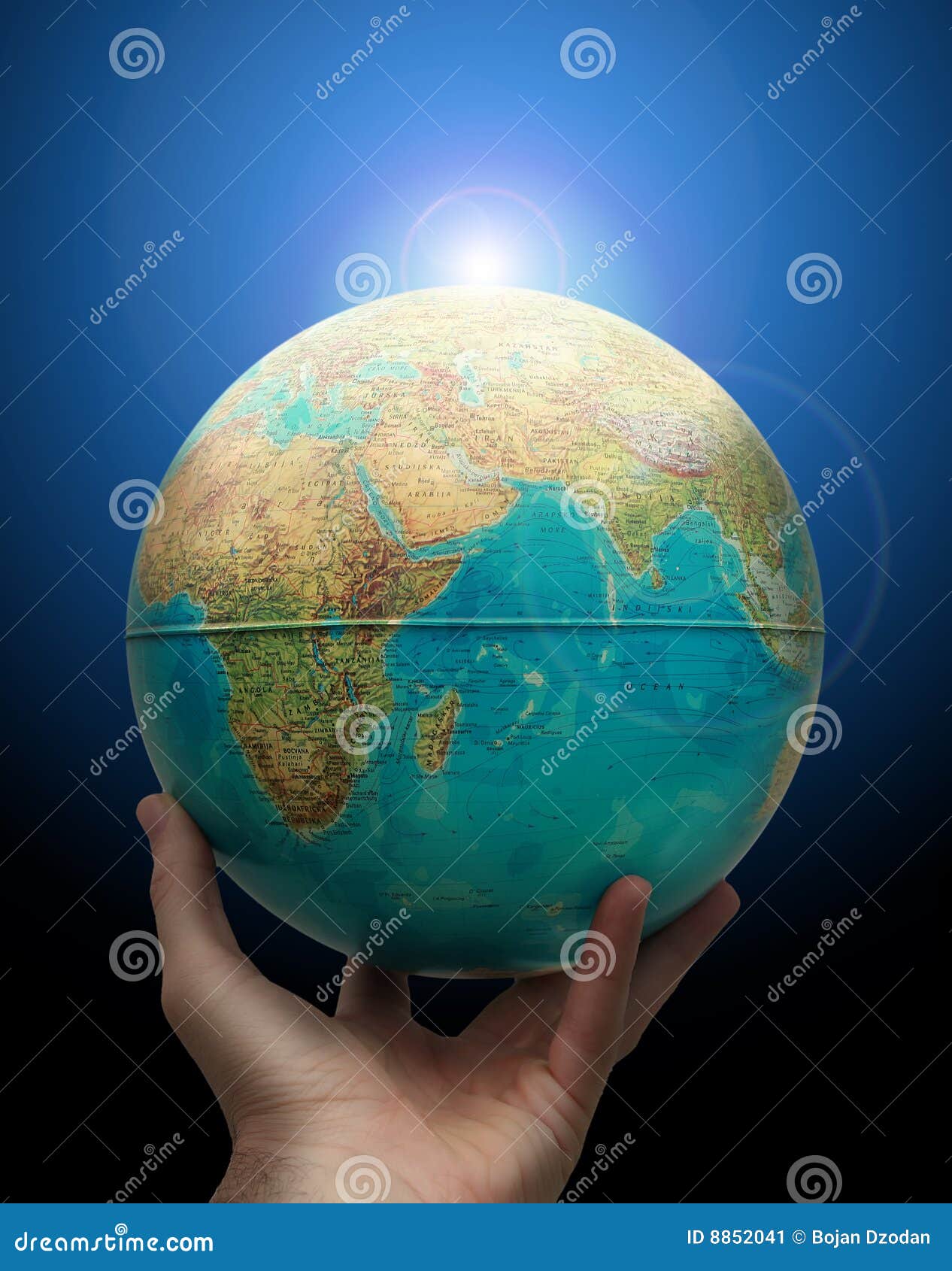 Globe in Hand with Rising Sun Stock Image - Image of holding, hand: 8852041