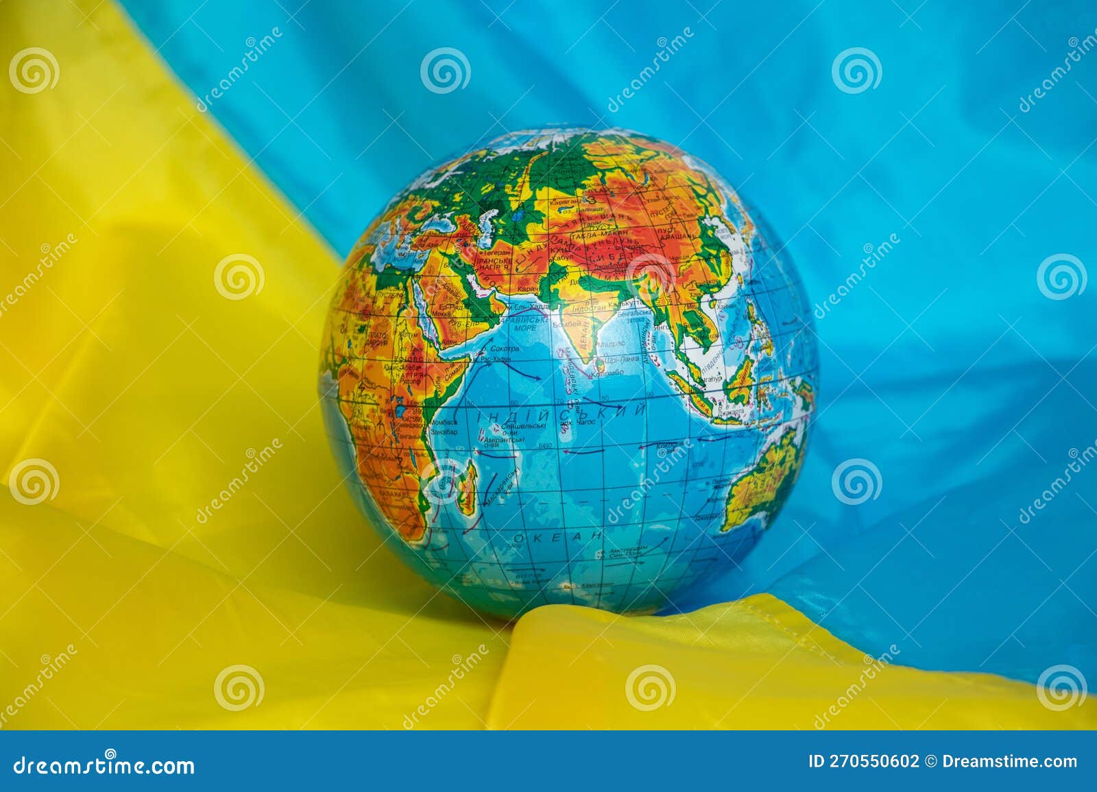 The Globe Lies on the Flags of Ukraine Close Up Stock Photo - Image of ...