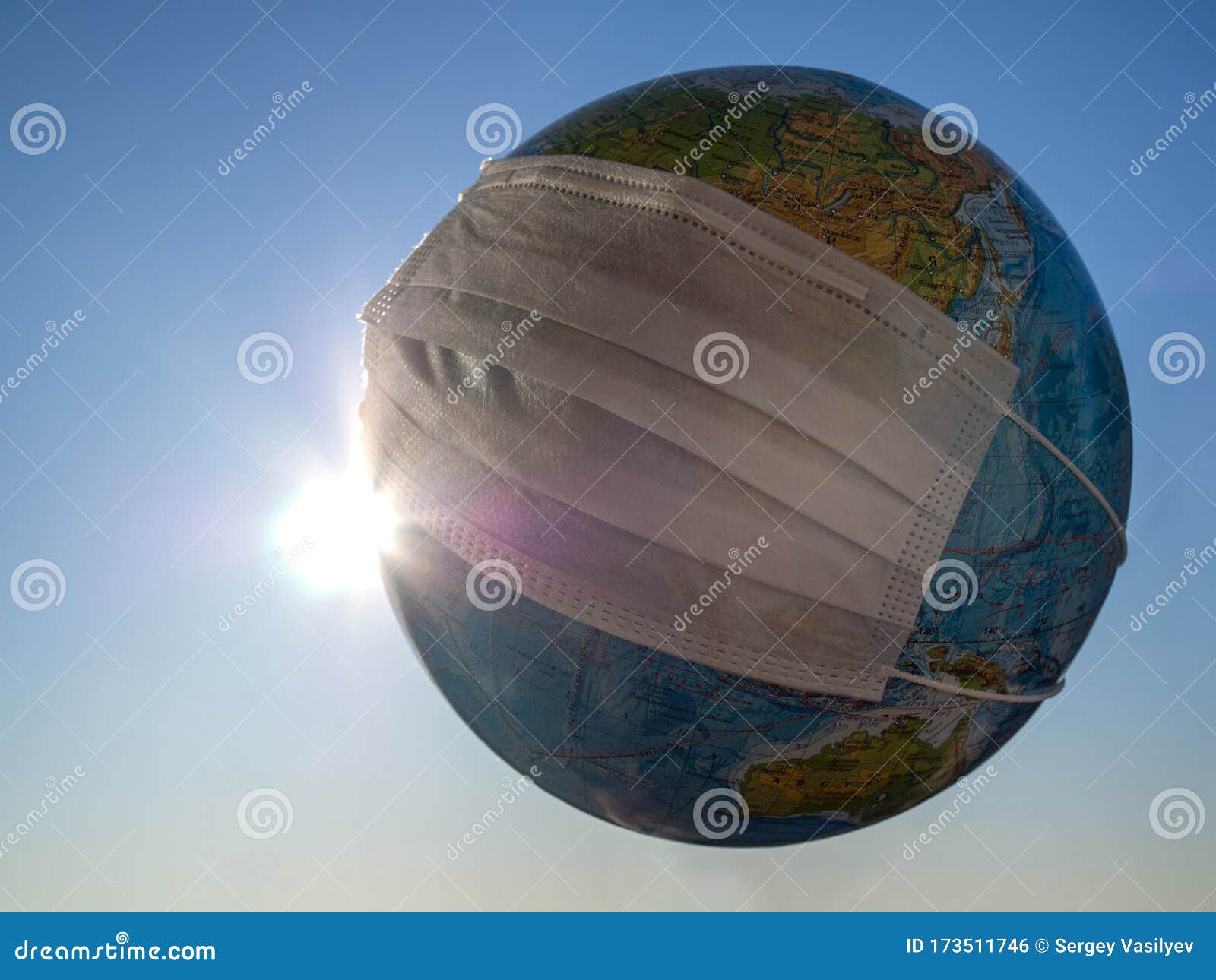 Globe in a medical mask stock photo. Image of virus - 173511746