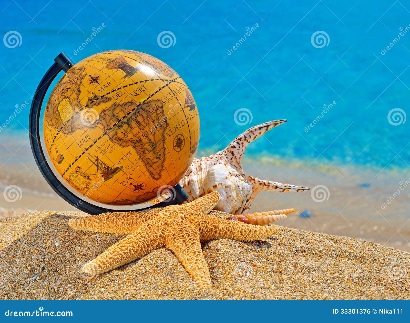 Globe, Shells, Starfish in the Beach Near Ocean Stock Photo - Image of ...