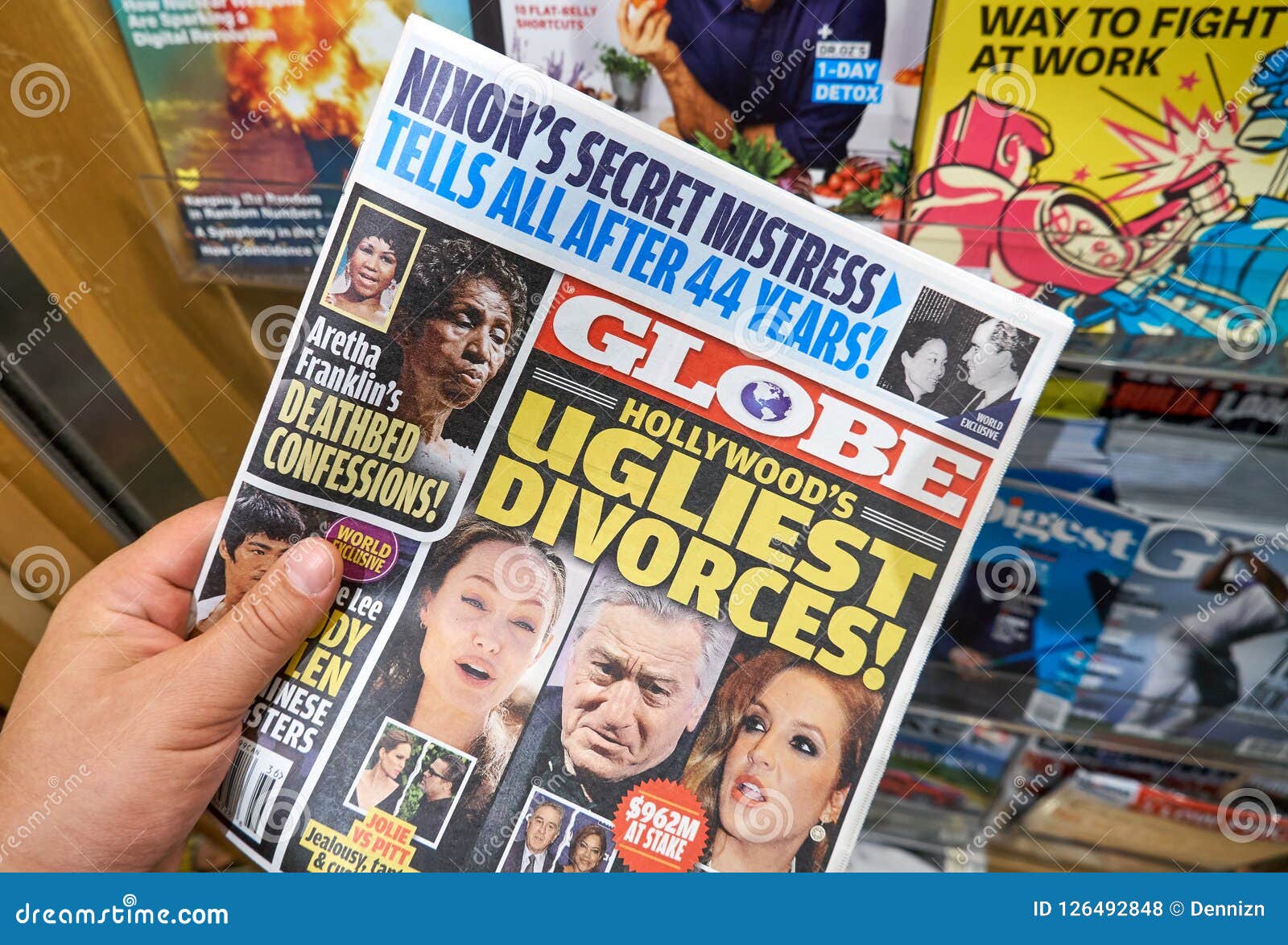 Globe tabloid in a hand editorial stock photo. Image of holding - 126492848