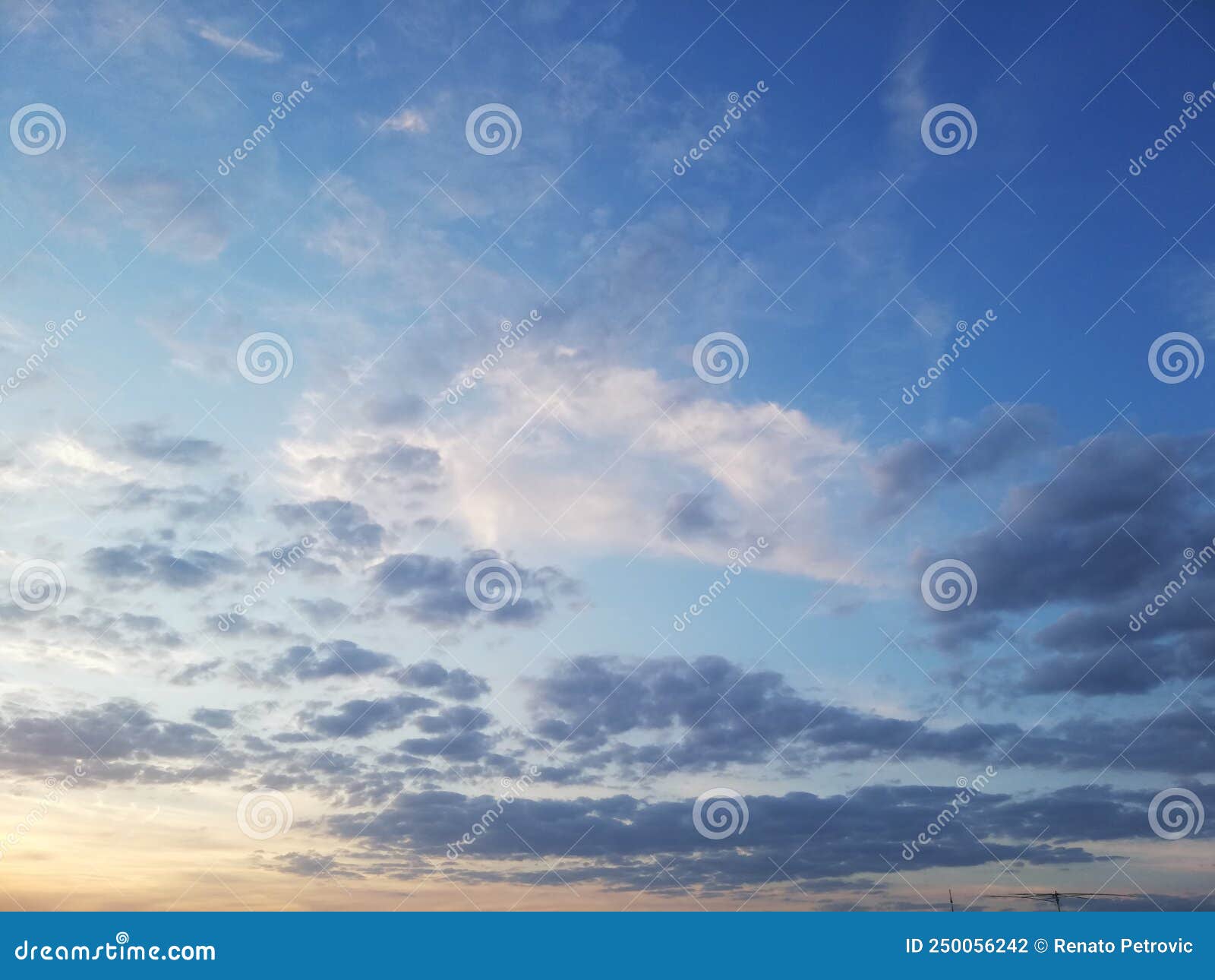 Glorious Blue Sunset Sky with Clouds Layers that Accentuate the Horizon ...