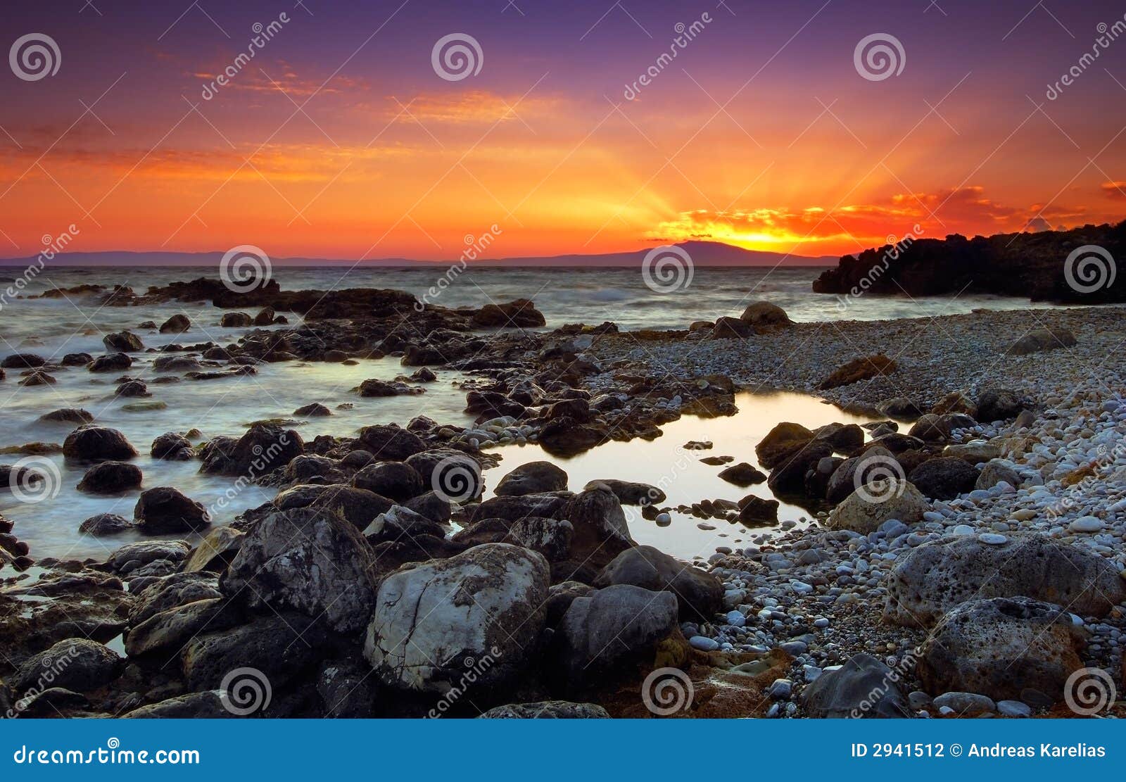Glorious sunset over rocks stock photo. Image of seascape - 2941512