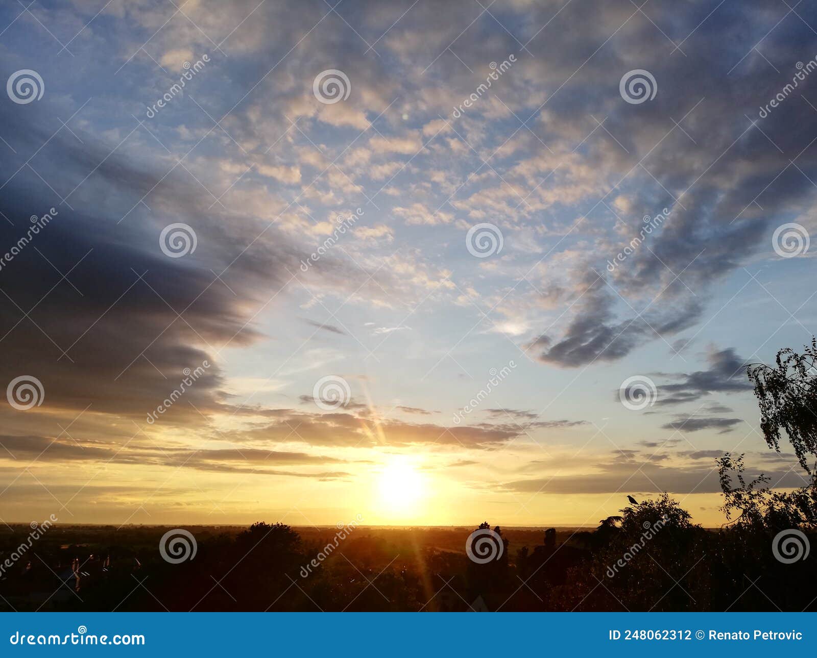 Glorious Sunset Sky with Clouds Layers that Accentuate the Horizon ...