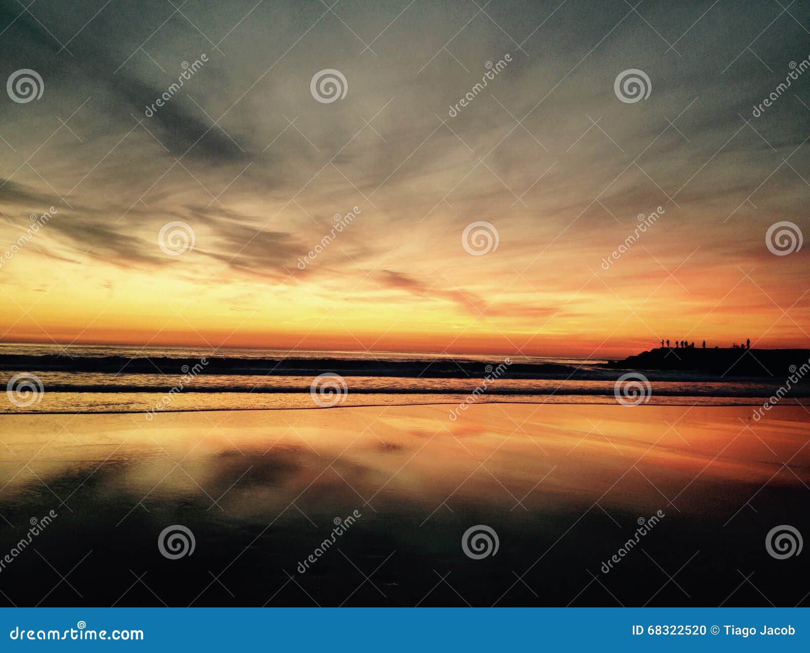Glorious Sunset View from the Beach with Fisherman in the Back Stock ...