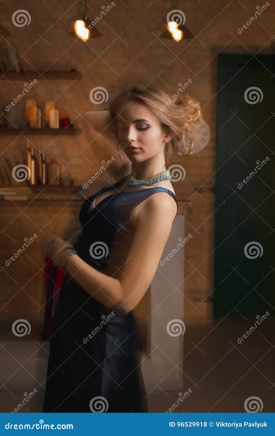 Glorious Young Woman in Dress Posing on a Background of Mixed Stock ...