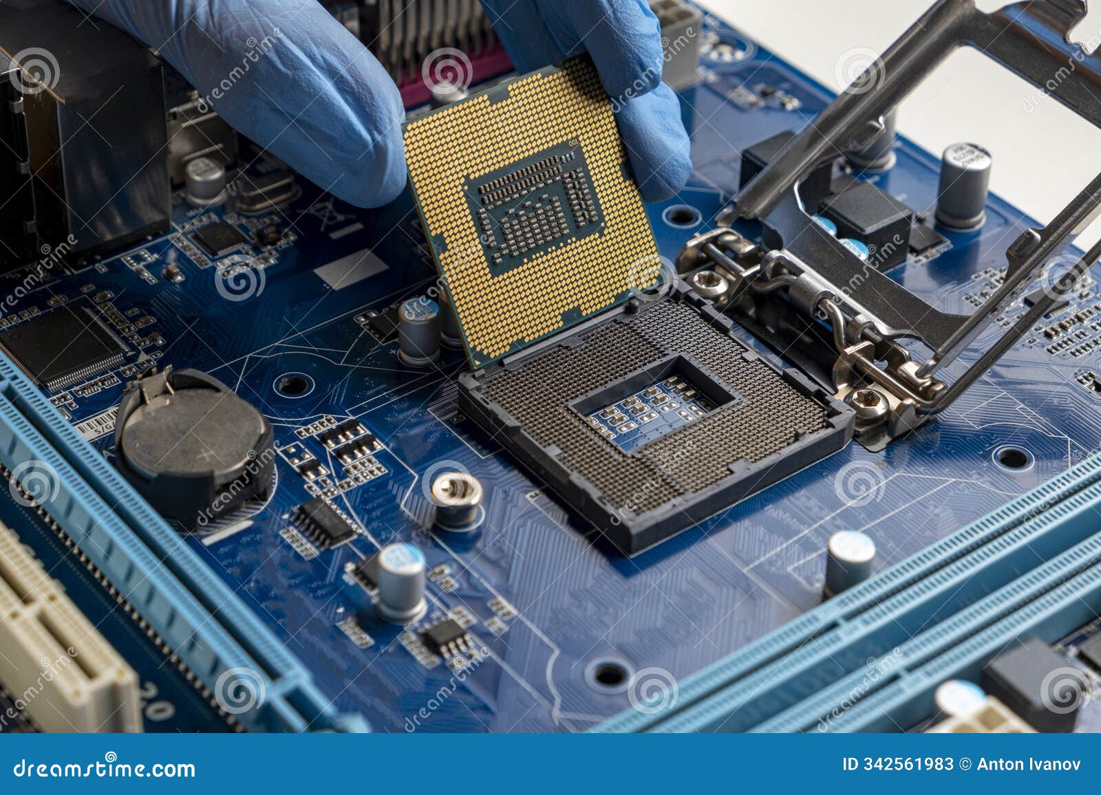 Gloved Hand Holding Microprocessor Near the Motherboard. Stock Image ...