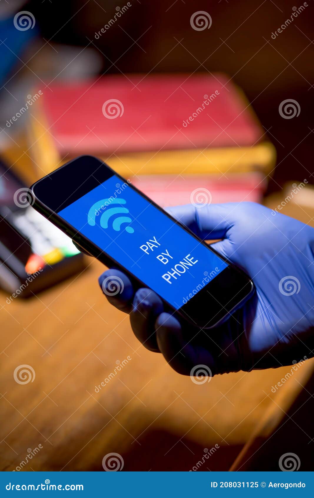 Gloved Hand Paying with Pay by Phone System at Bookshop Stock Image ...