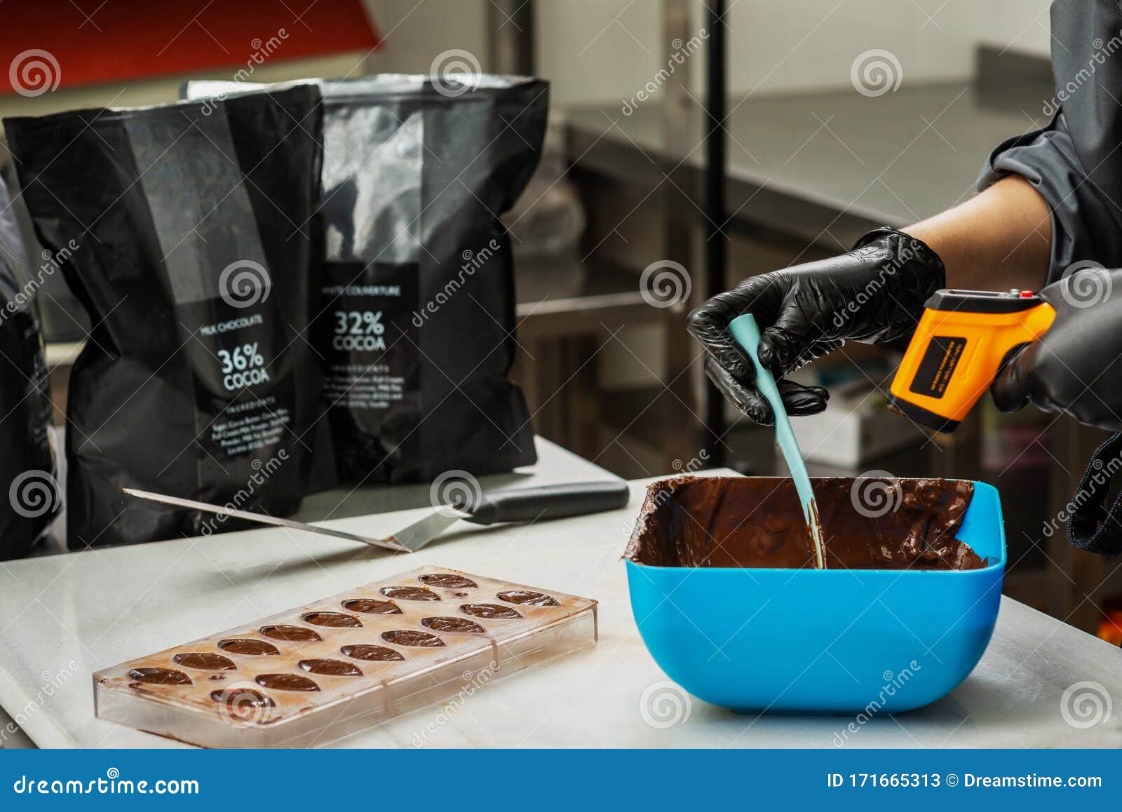 Confectioner in Gloves Makes Chocolates in Forms Stock Image - Image of ...