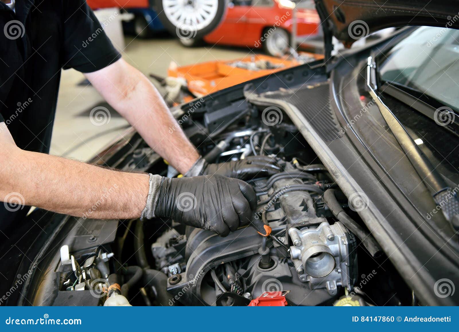 Gloved Hands of a Mechanic Working on an Engine Stock Photo - Image of ...