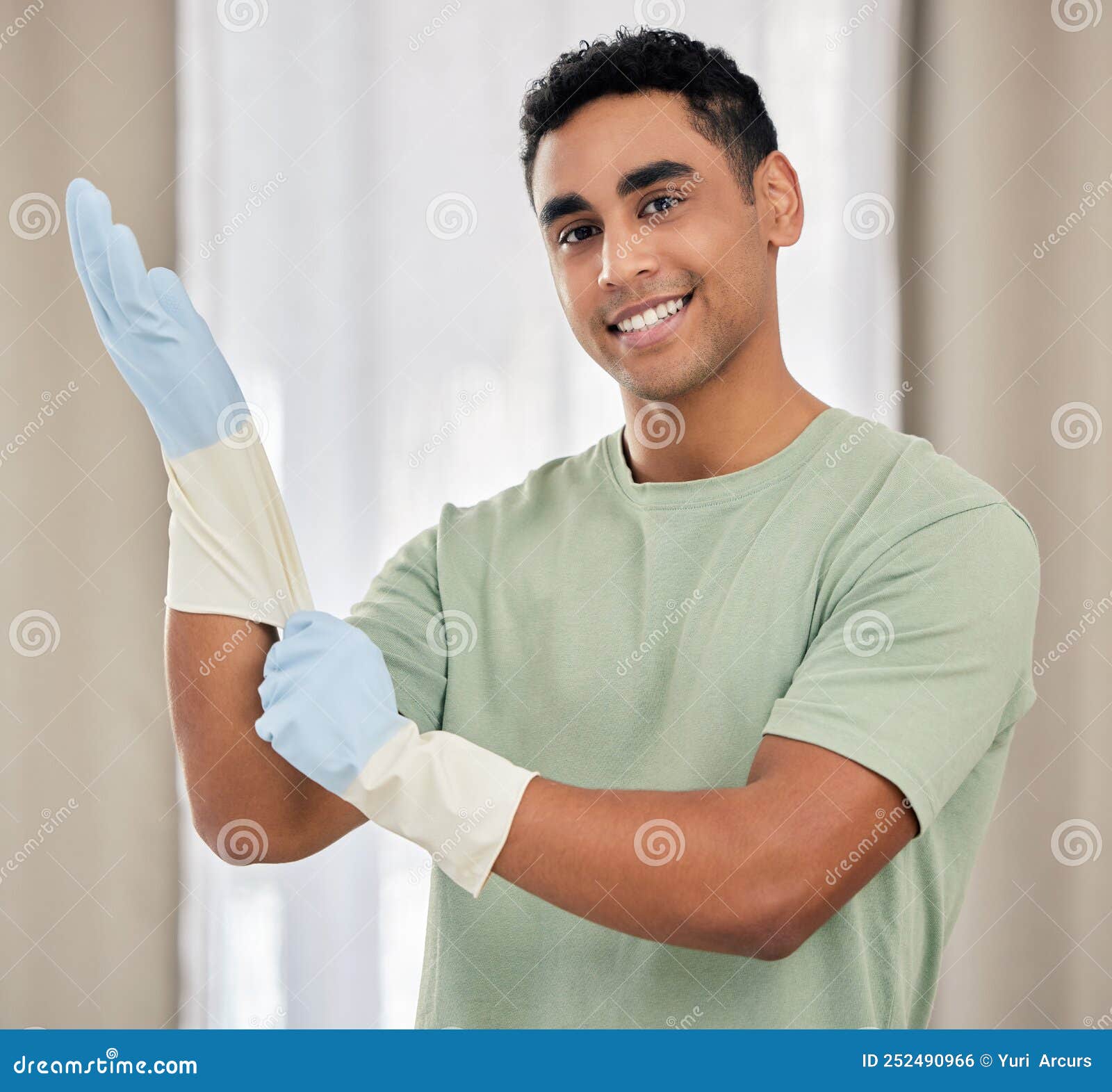 Gloves at the Ready. a Young Man Applying Latex Gloves. Stock Photo ...