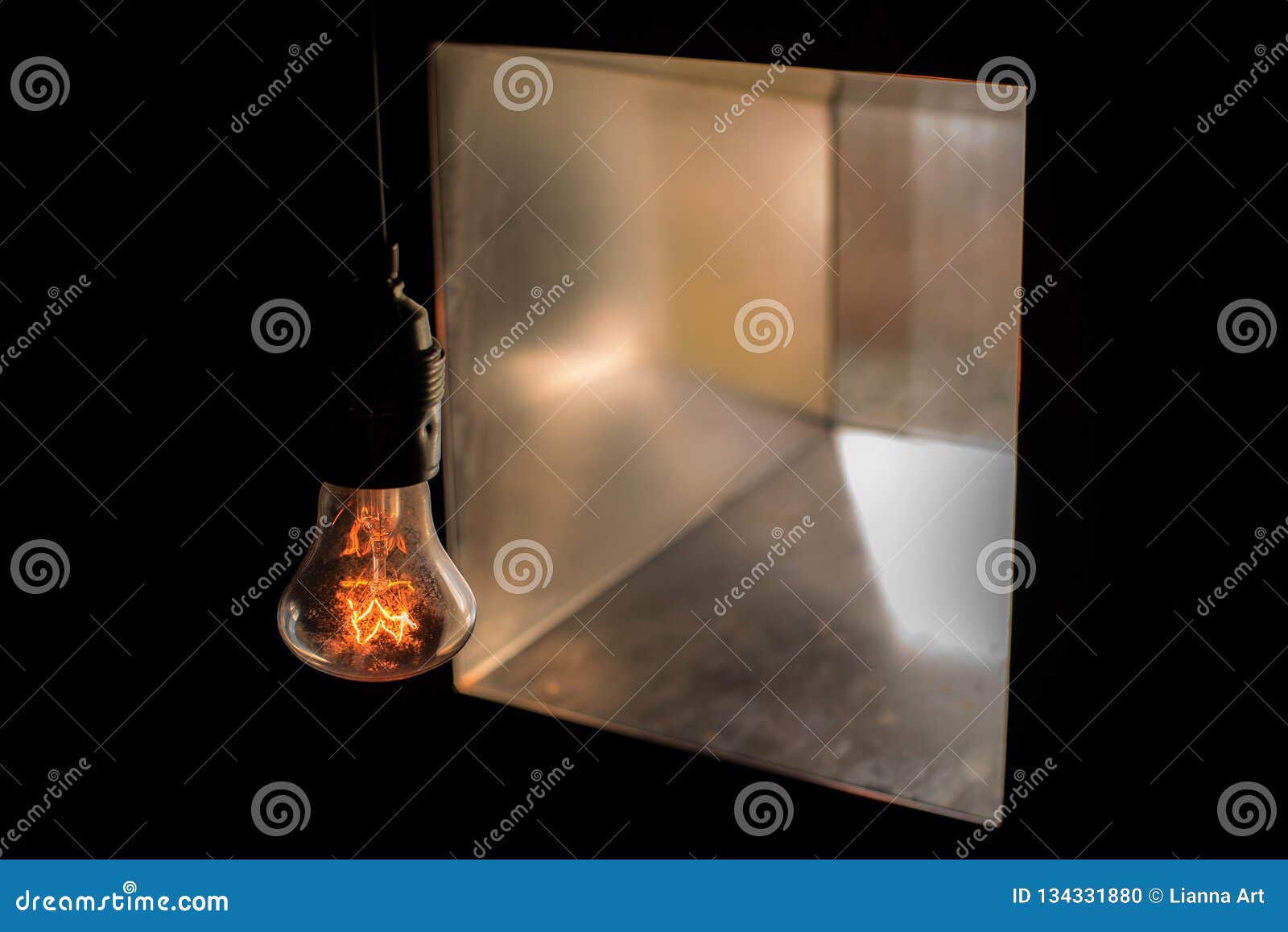Glow Lamp Bulb without Lamp Shade in the Dark Opposite To a Square ...