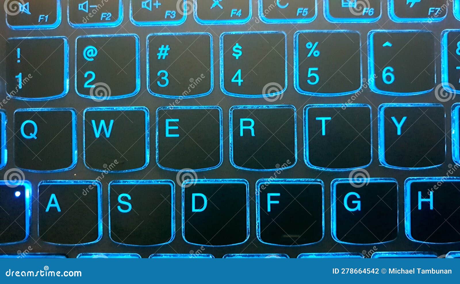 Glowing Blue Light Qwerty Keyboard Stock Photo - Image of science ...