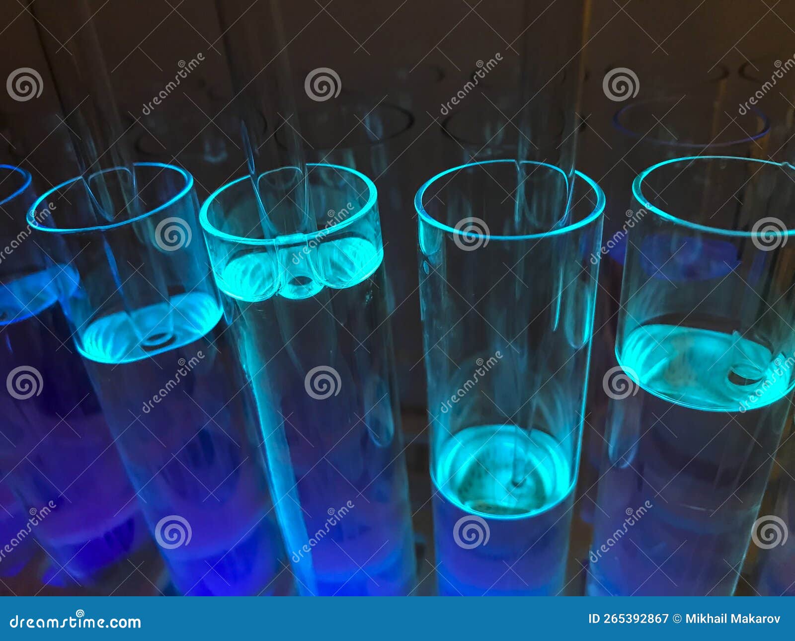 Glowing Blue Luminescent Solutions in Chemical Test Tubes Stock Image ...