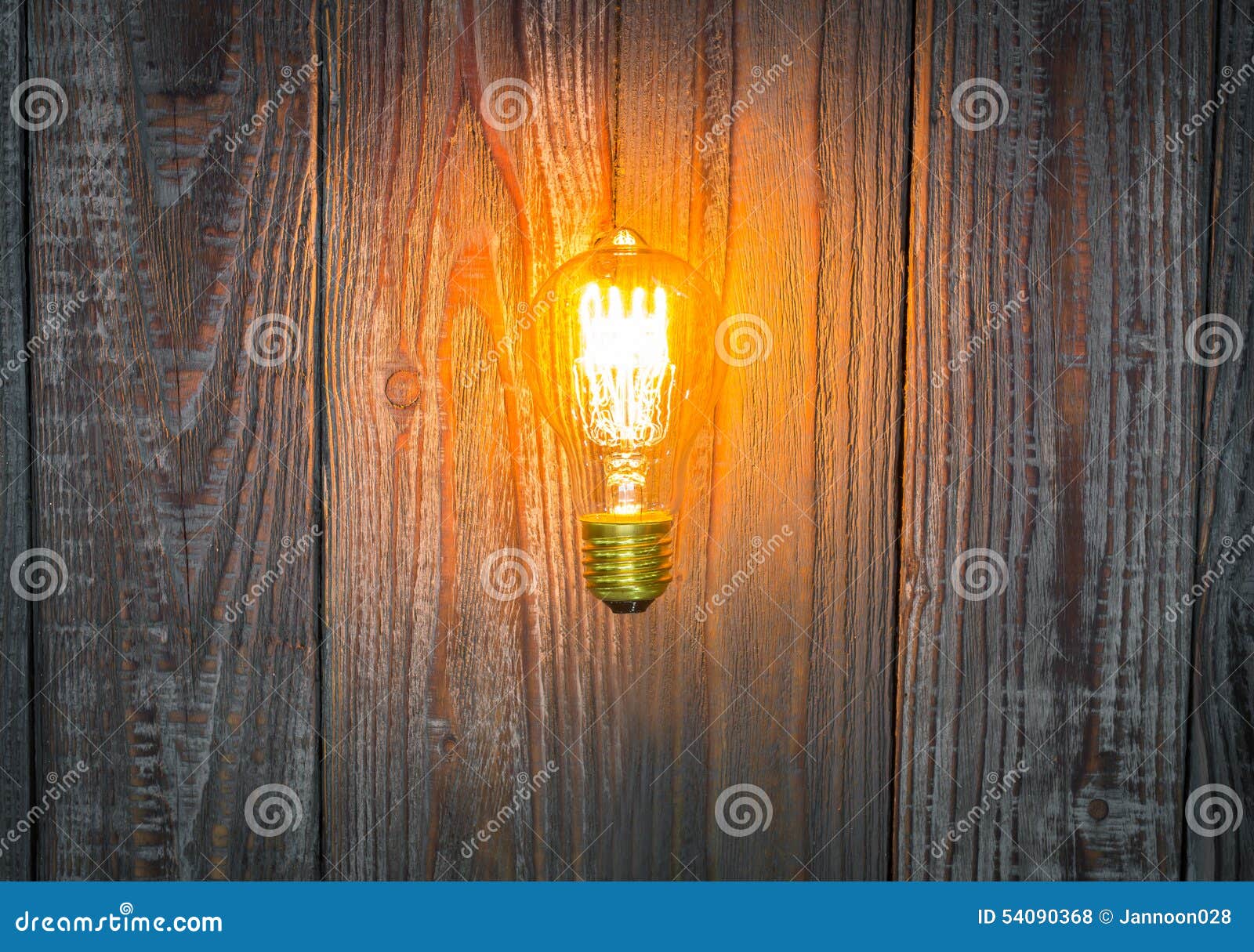 Glowing bulb on the wood stock photo. Image of power - 54090368