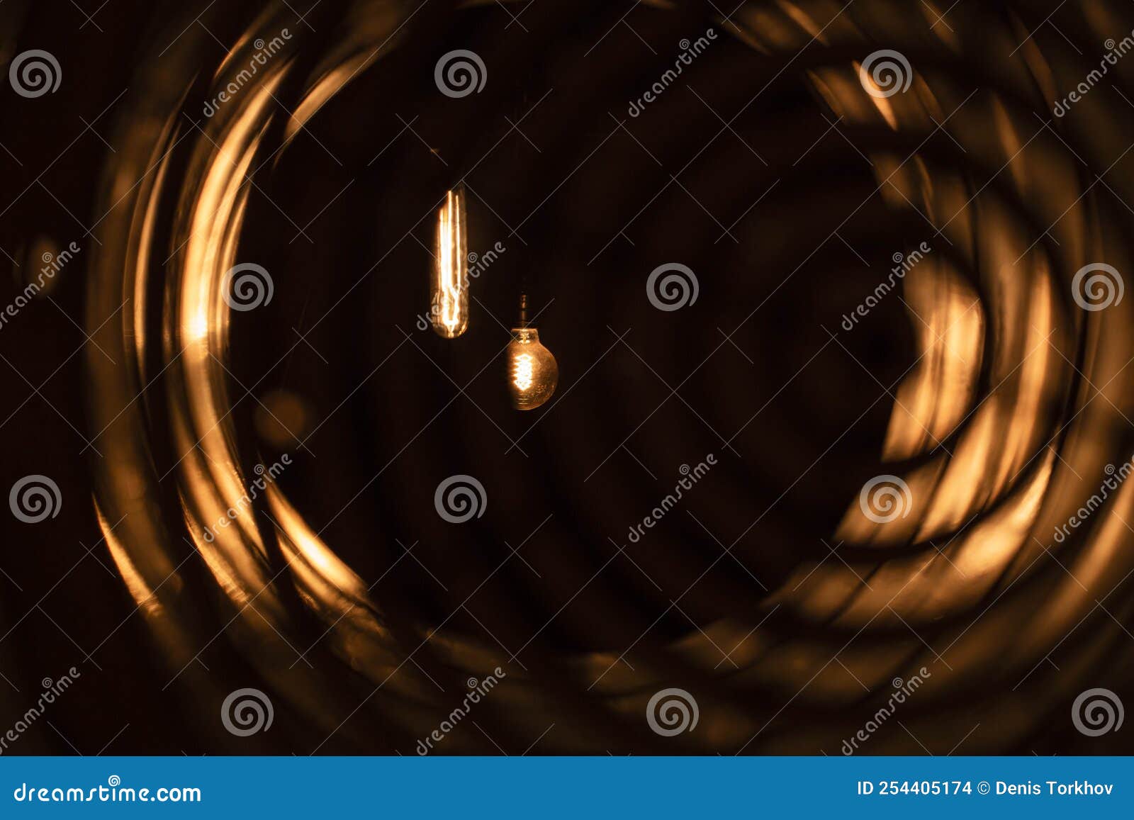 Glowing Bulbs with Edison Filament Visible from the Ventilation Duct ...