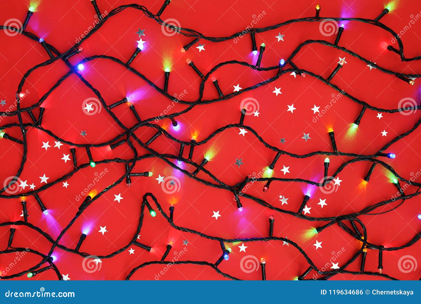 Glowing Christmas Lights on Color Background Stock Photo - Image of ...