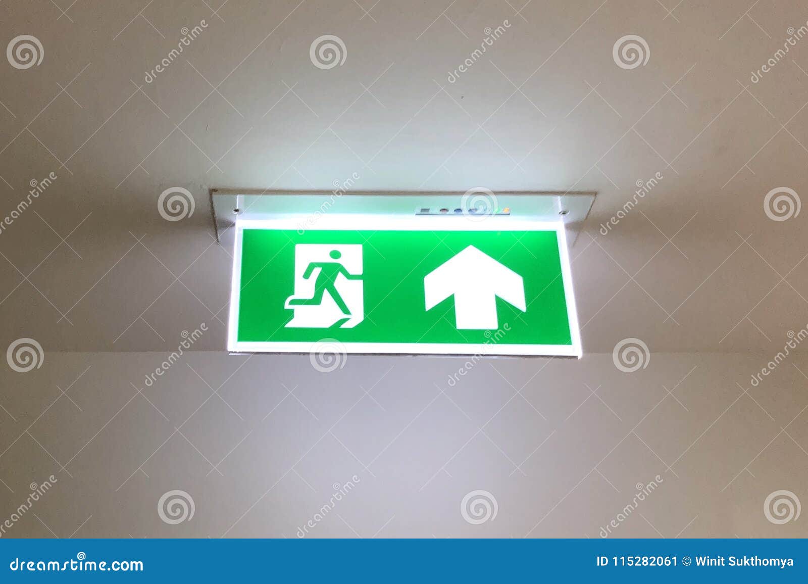 Glowing Emergency Exit Sign Stock Image - Image of white, building ...