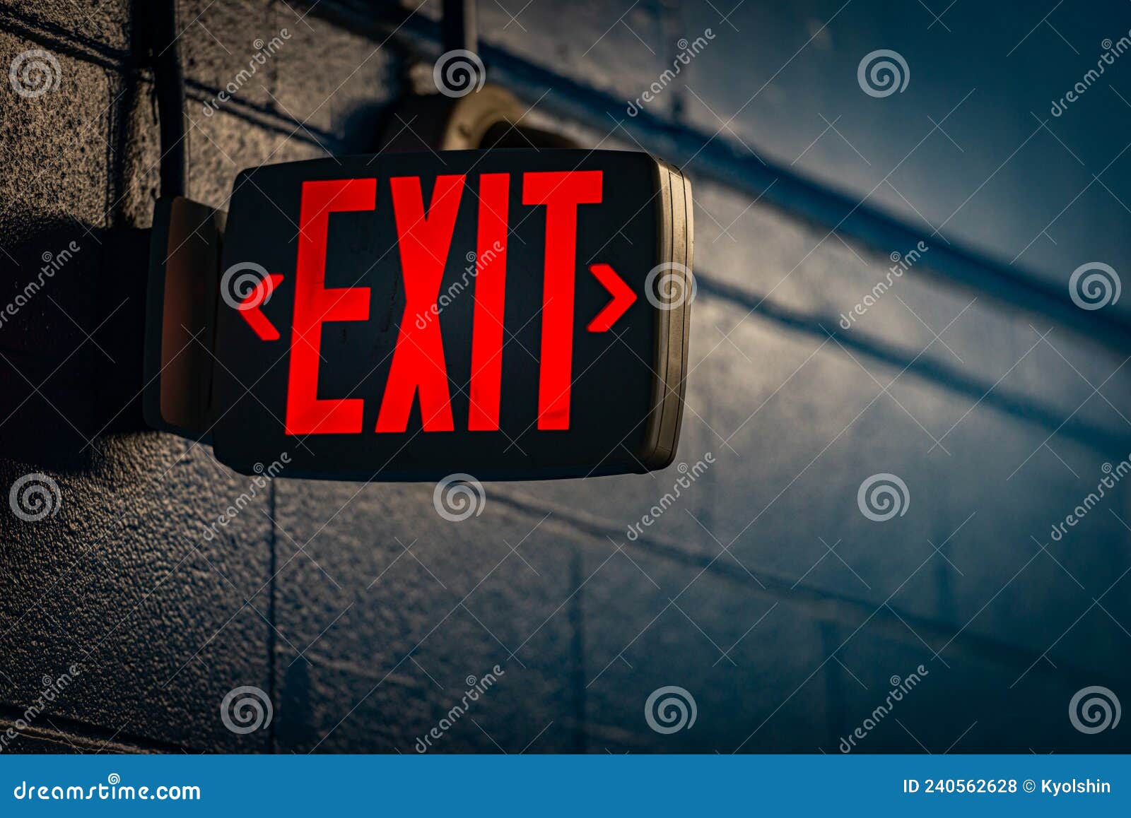 Glowing Exit Sign by Night on Wall Stock Photo - Image of exit, symbol ...