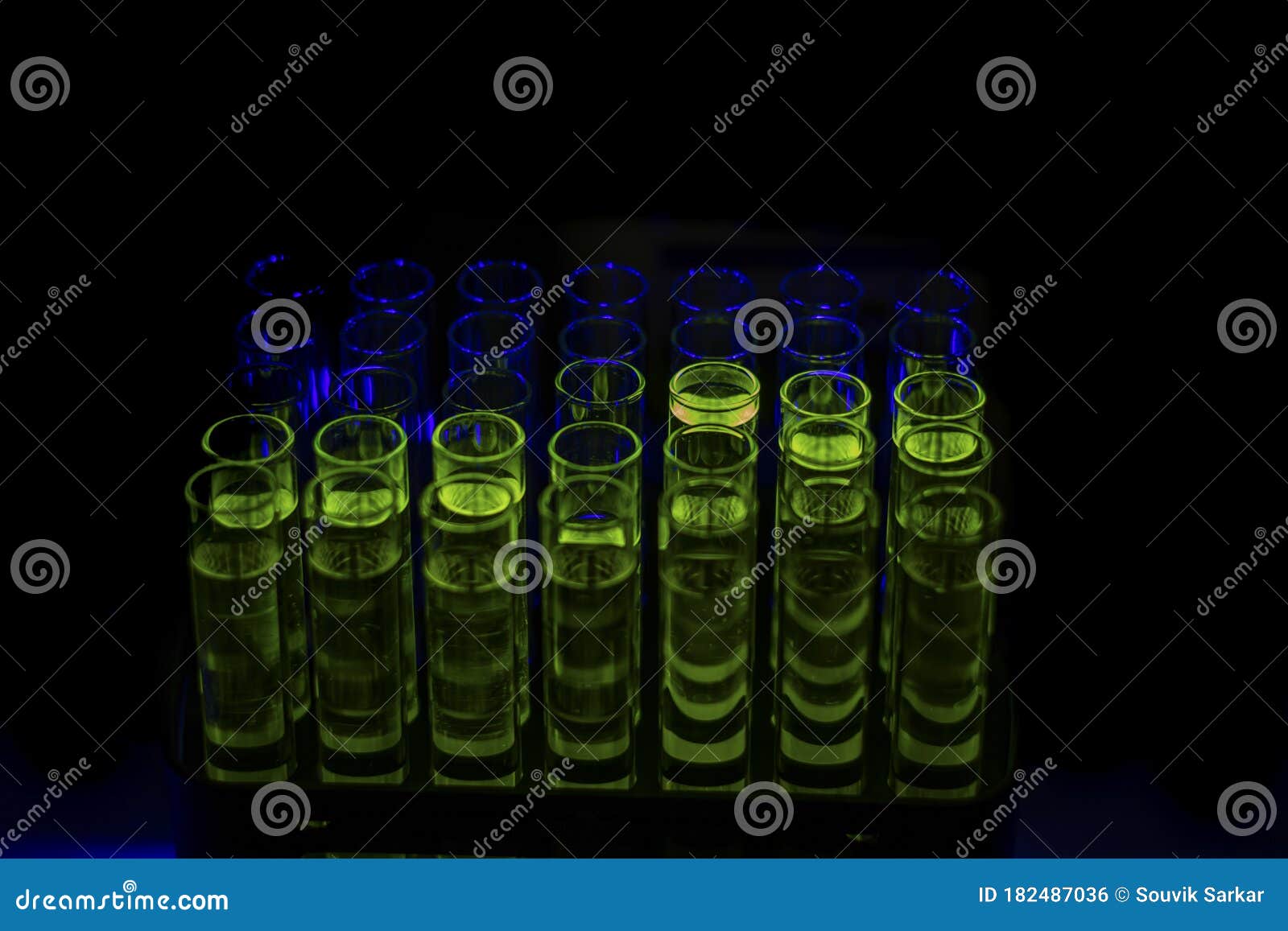 Glowing Green Compound Solution Collected from Column Chromatography in ...