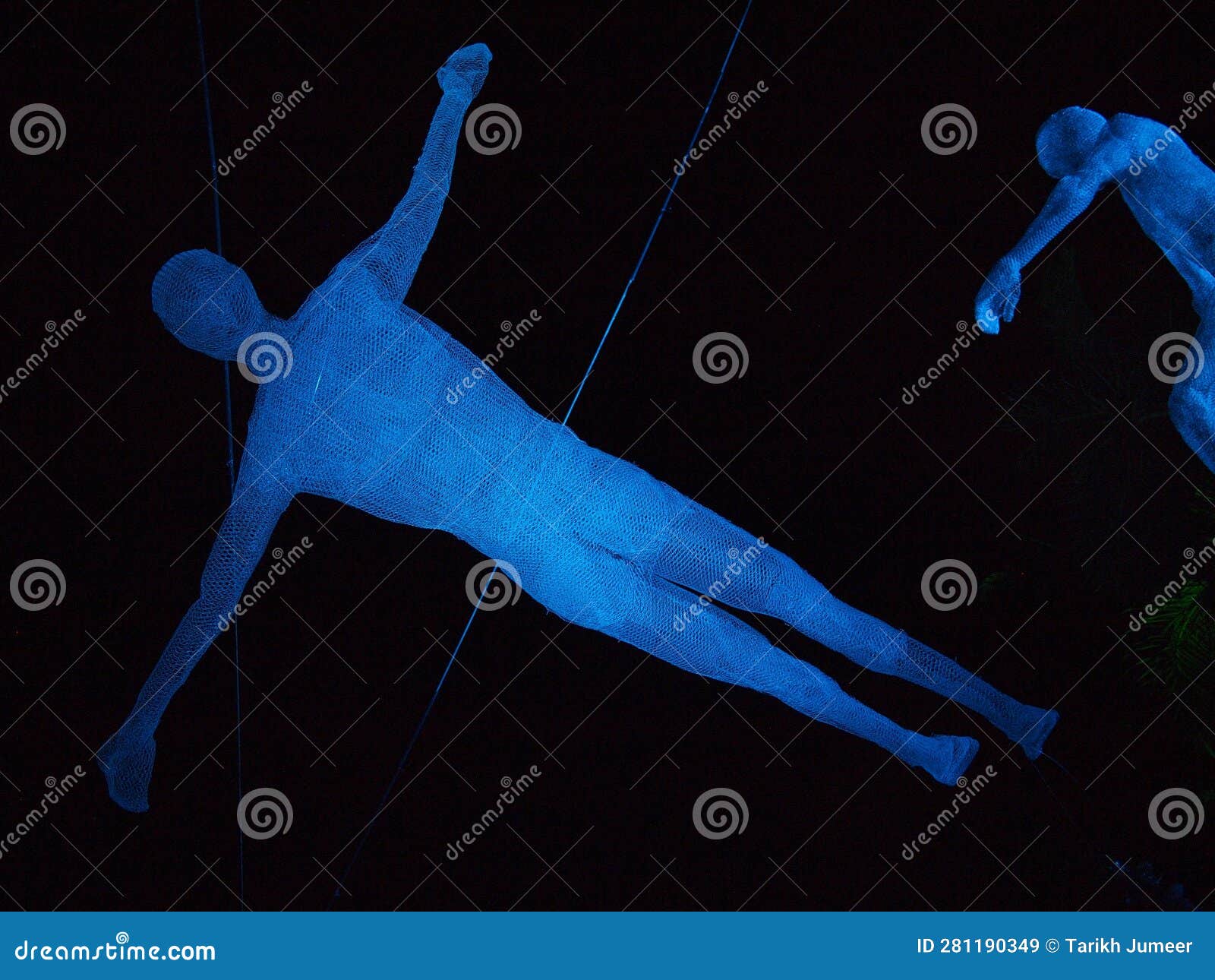 Glowing Humanoid Figures Hanging in the Dark Stock Image - Image of ...