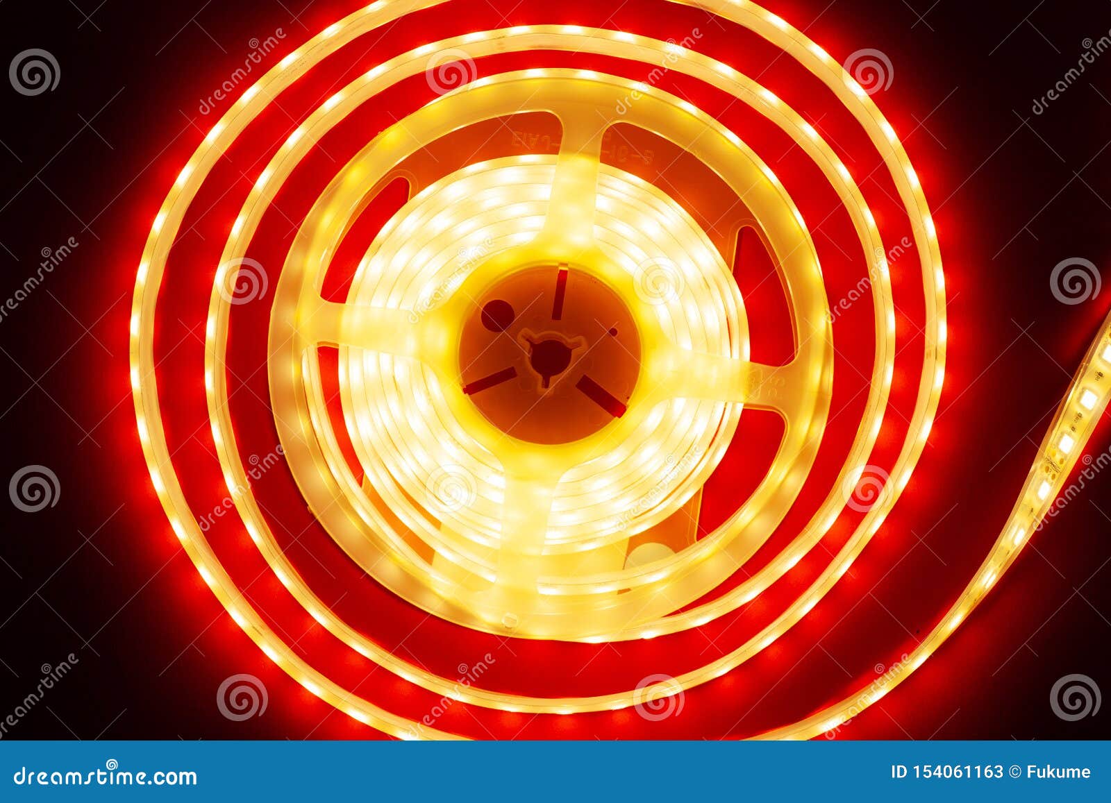 Glowing LED Strip on a Red Background, Copy Space Top View Led Light ...