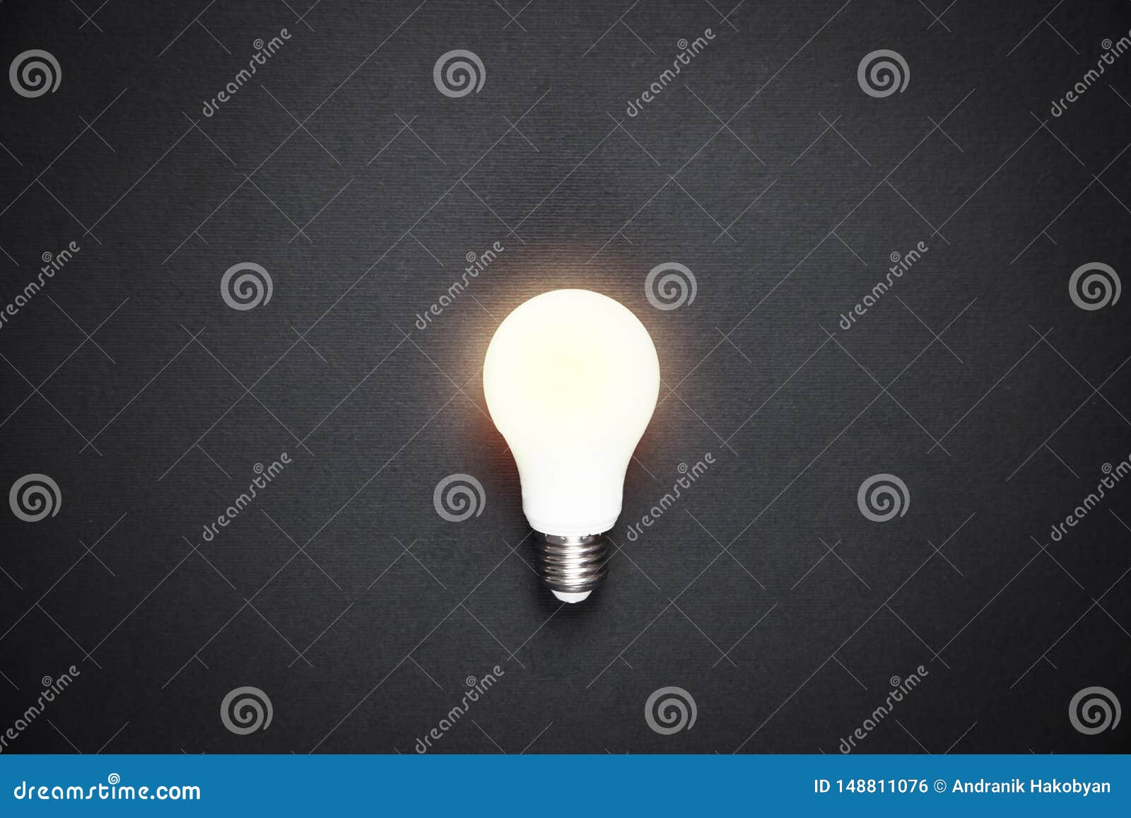 Glowing Light Bulb in the Black Background Stock Photo - Image of ...