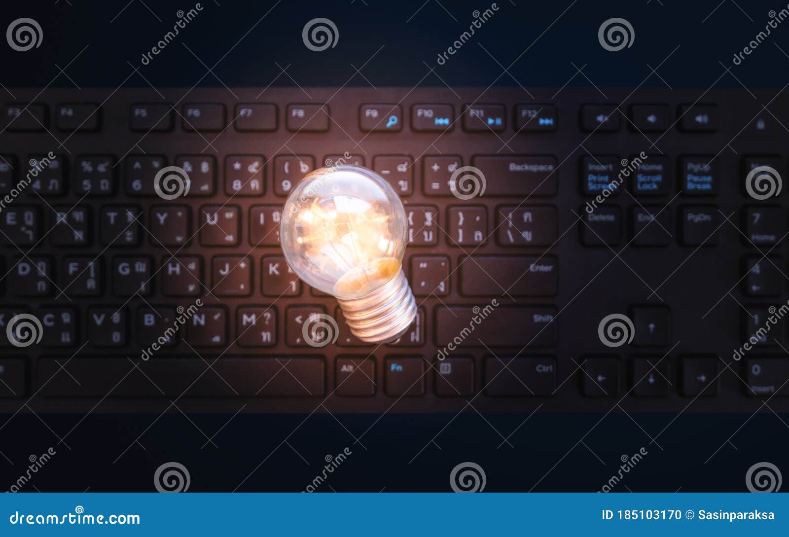 Glowing Light Bulb on Computer Keyboard Stock Photo - Image of ideas ...