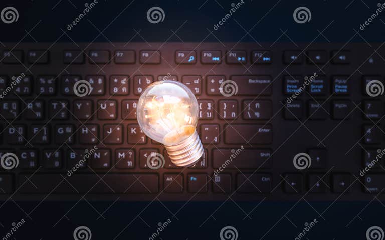 Glowing Light Bulb on Computer Keyboard Stock Photo - Image of ideas ...