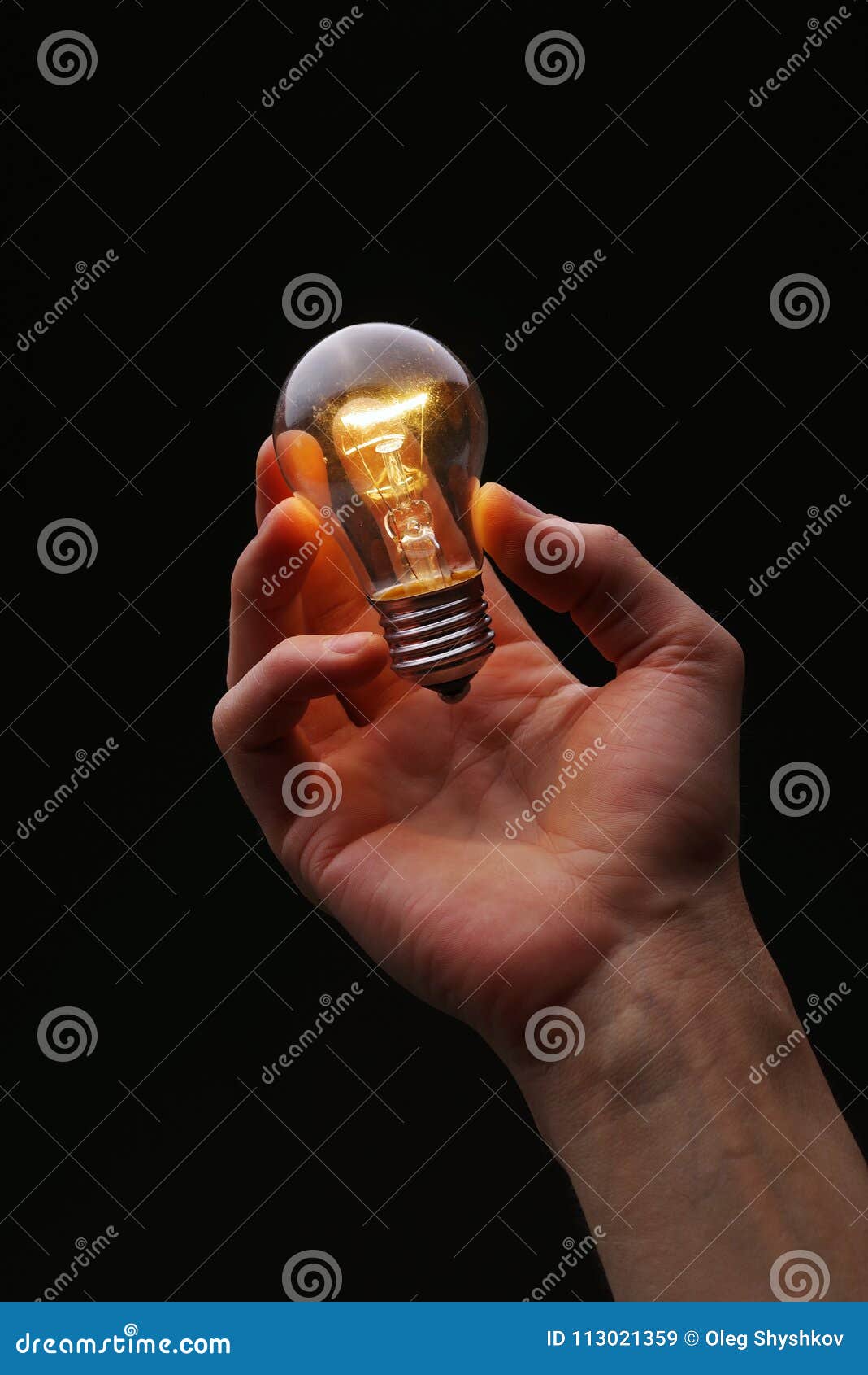 Glowing Light Bulb In Hand On A Dark Background. Stock Image - Image of ...