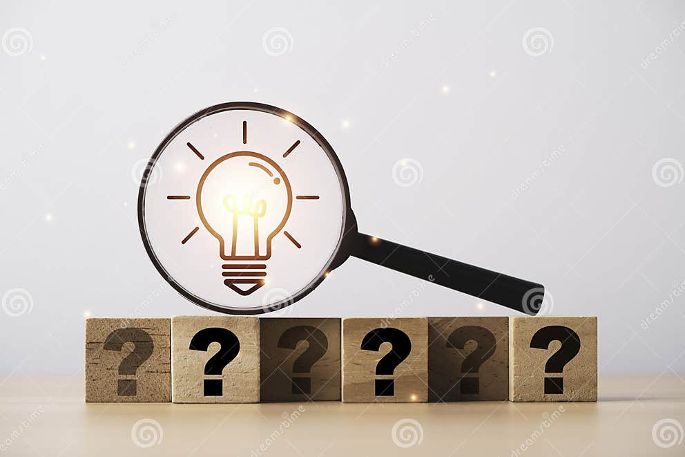 Glowing Light Bulb Inside Magnifier Glass on Question Mark for Focus ...
