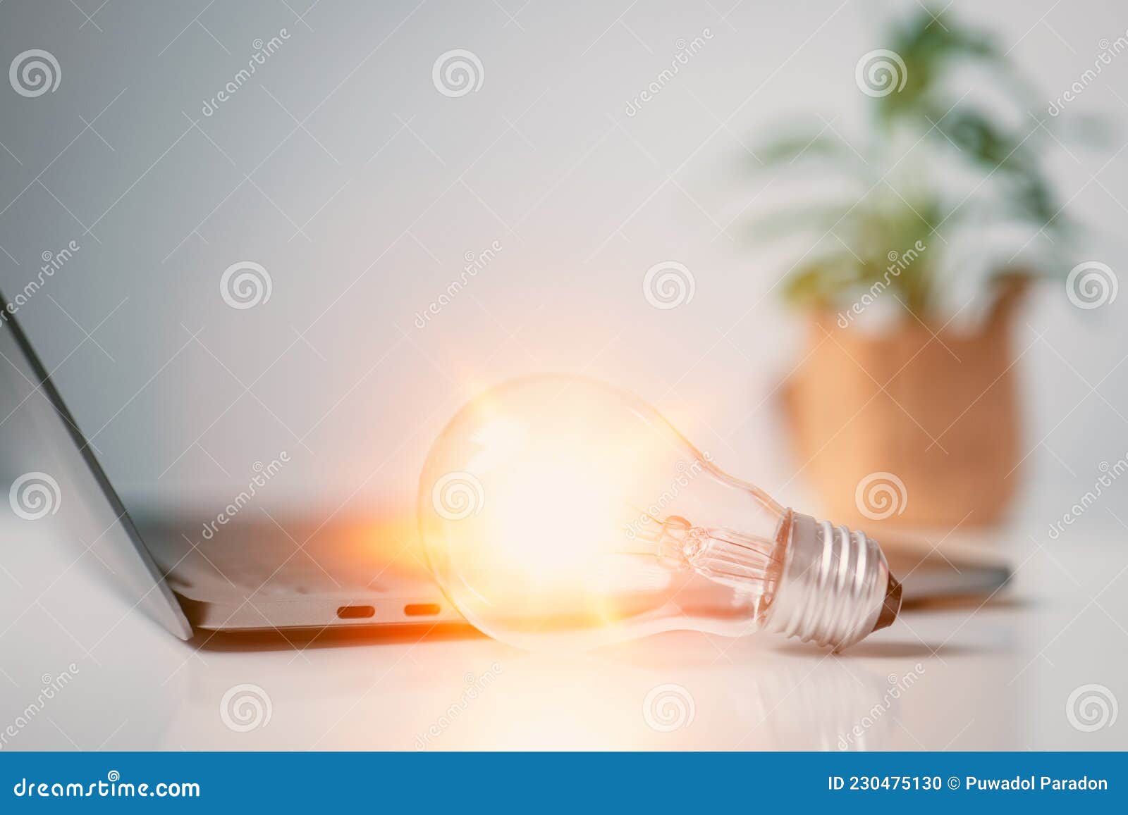 Glowing Light Bulb with Laptop Background. Self Learning or Education ...