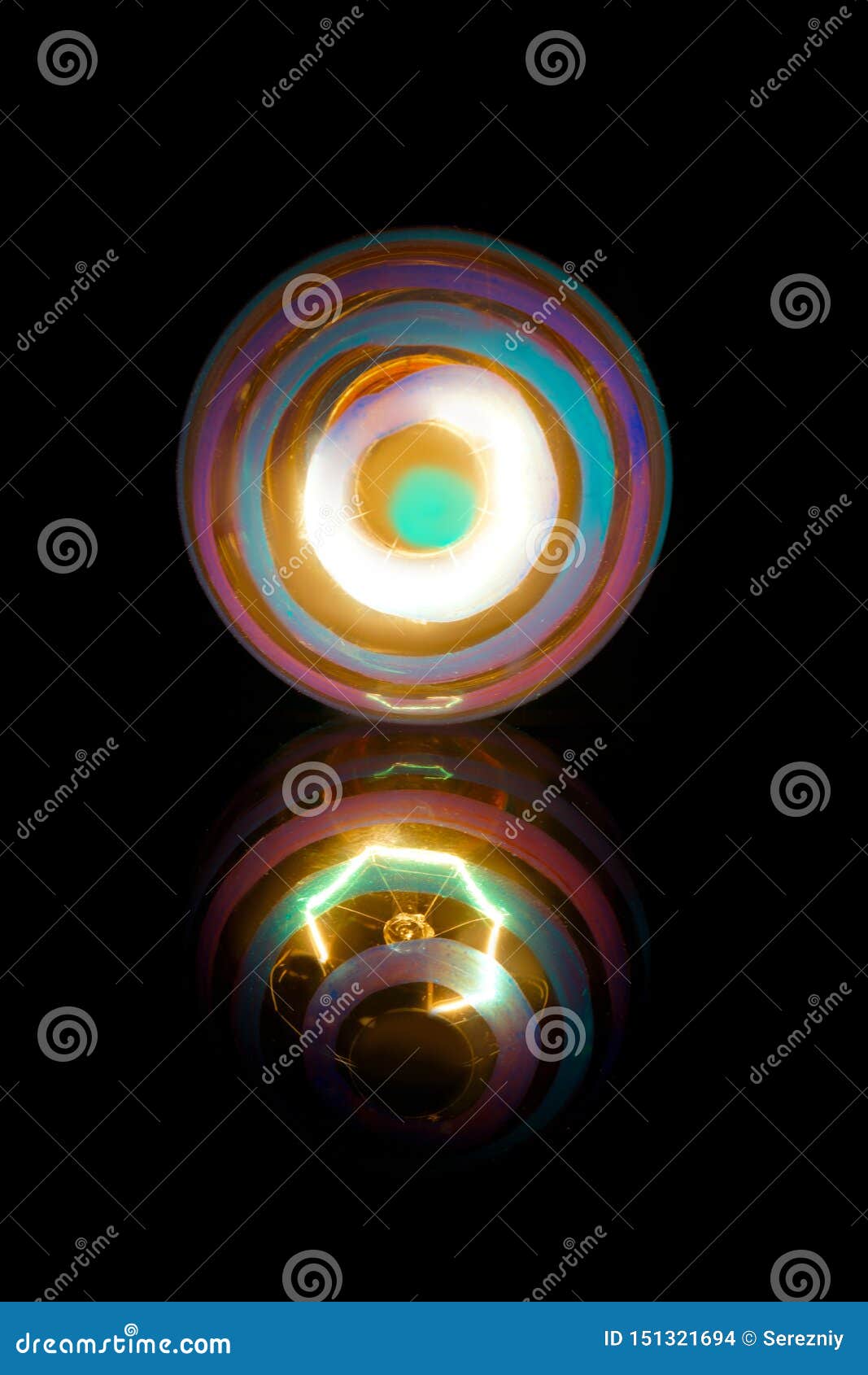 Glowing Light Bulb with Reflection on Black Background Stock Photo ...