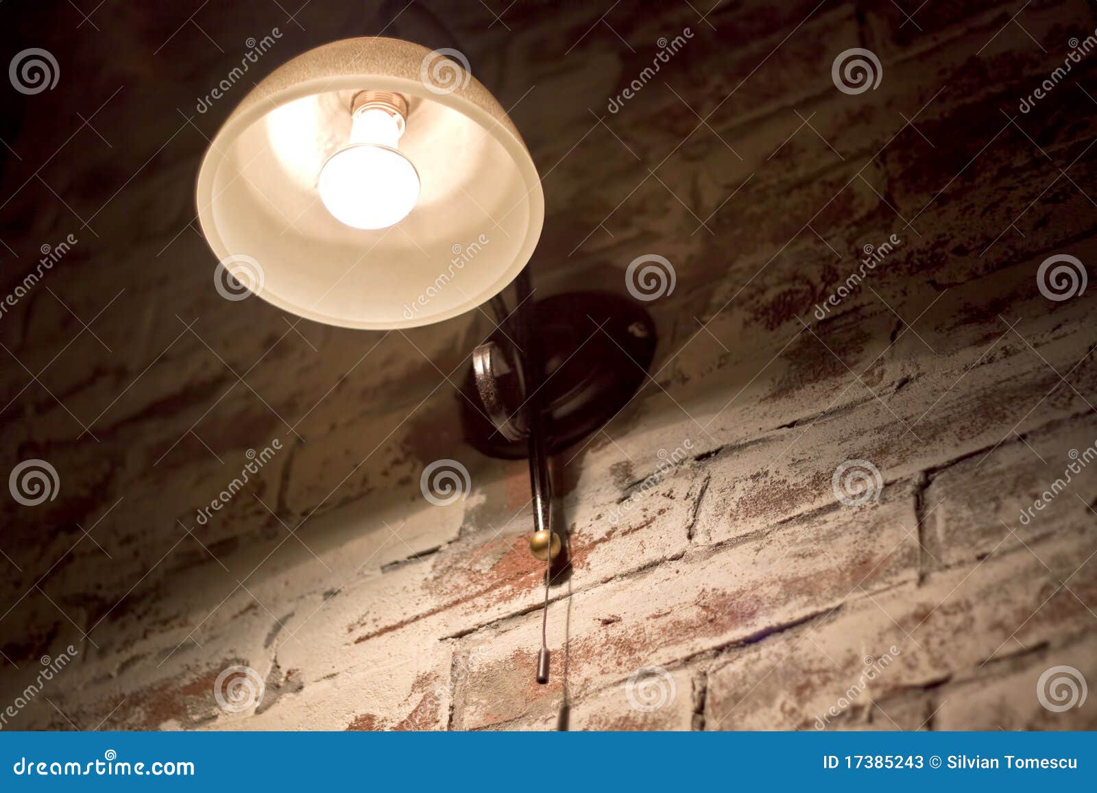 Glowing light bulb on wall stock image. Image of bricks - 17385243