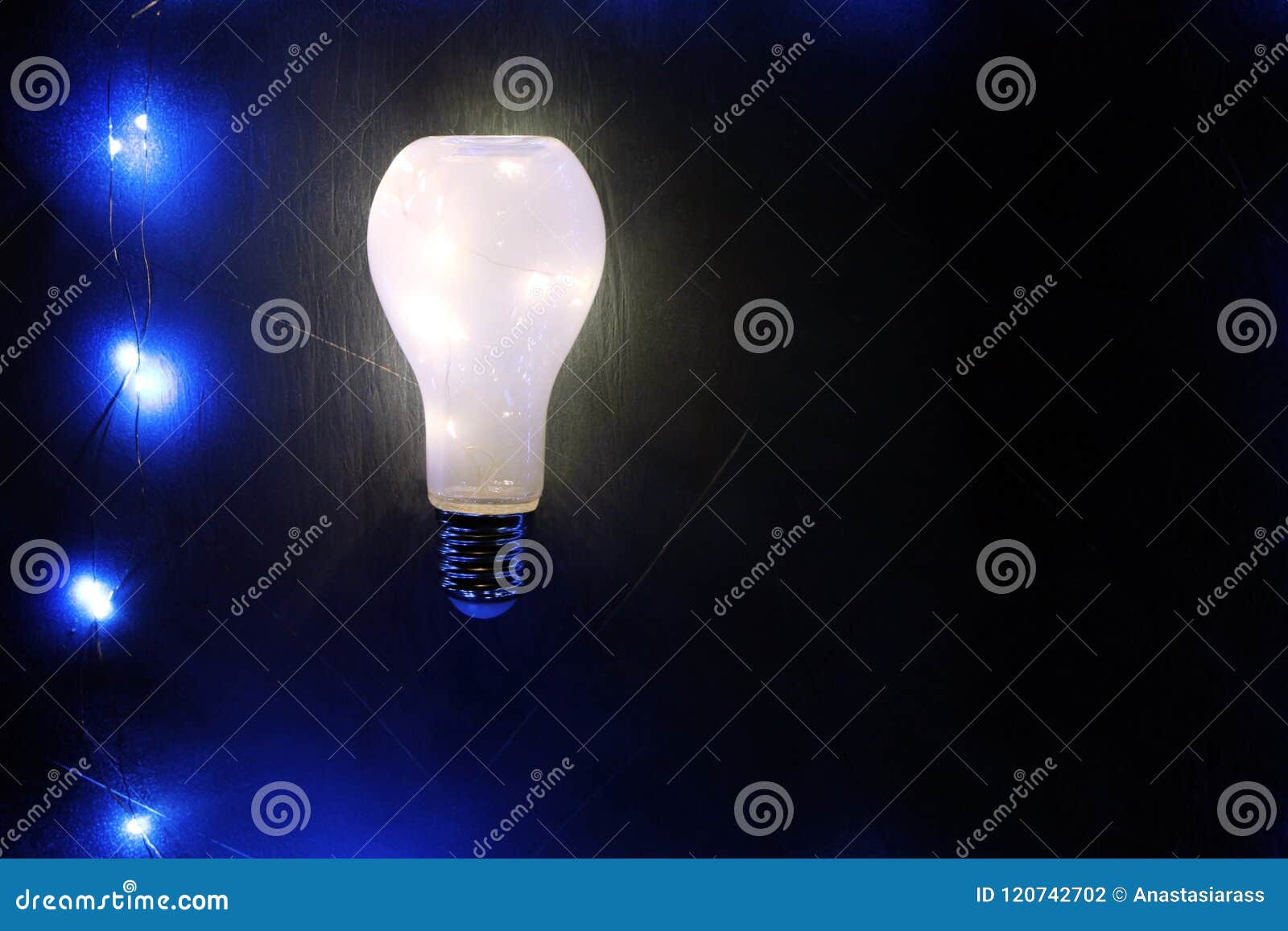 Glowing Lightbulb on Black Background Stock Photo - Image of electric ...