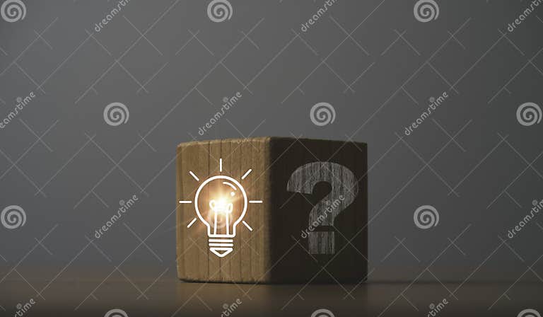 Glowing Lightbulb on Bright Side and Question Mark on Dark Side of Wooden Block Cube for Problem ...