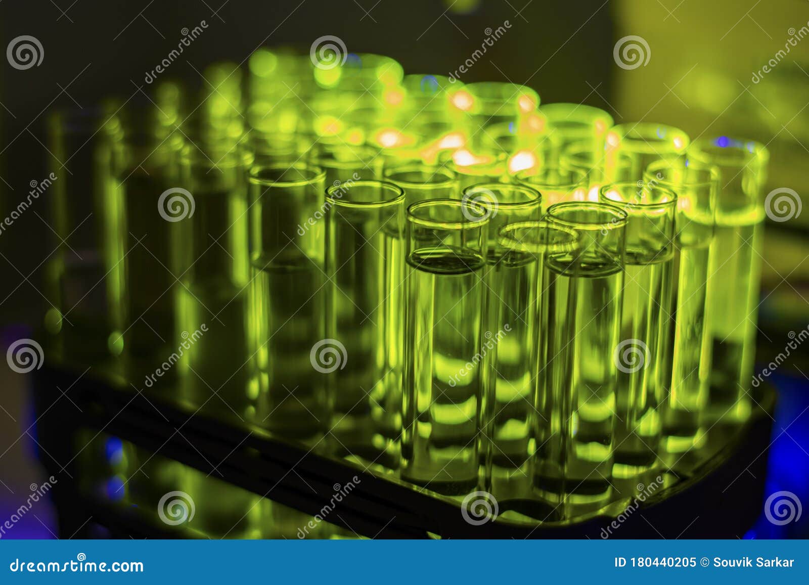 Glowing Organic Compound Fluid Collected from Column Chromatography in ...