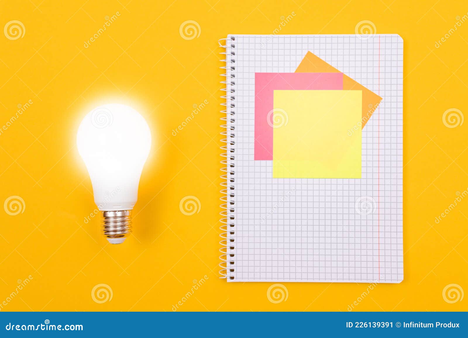 Glowing Power Saving Lamp and a Notepad with Sticky Notes Stock Image ...