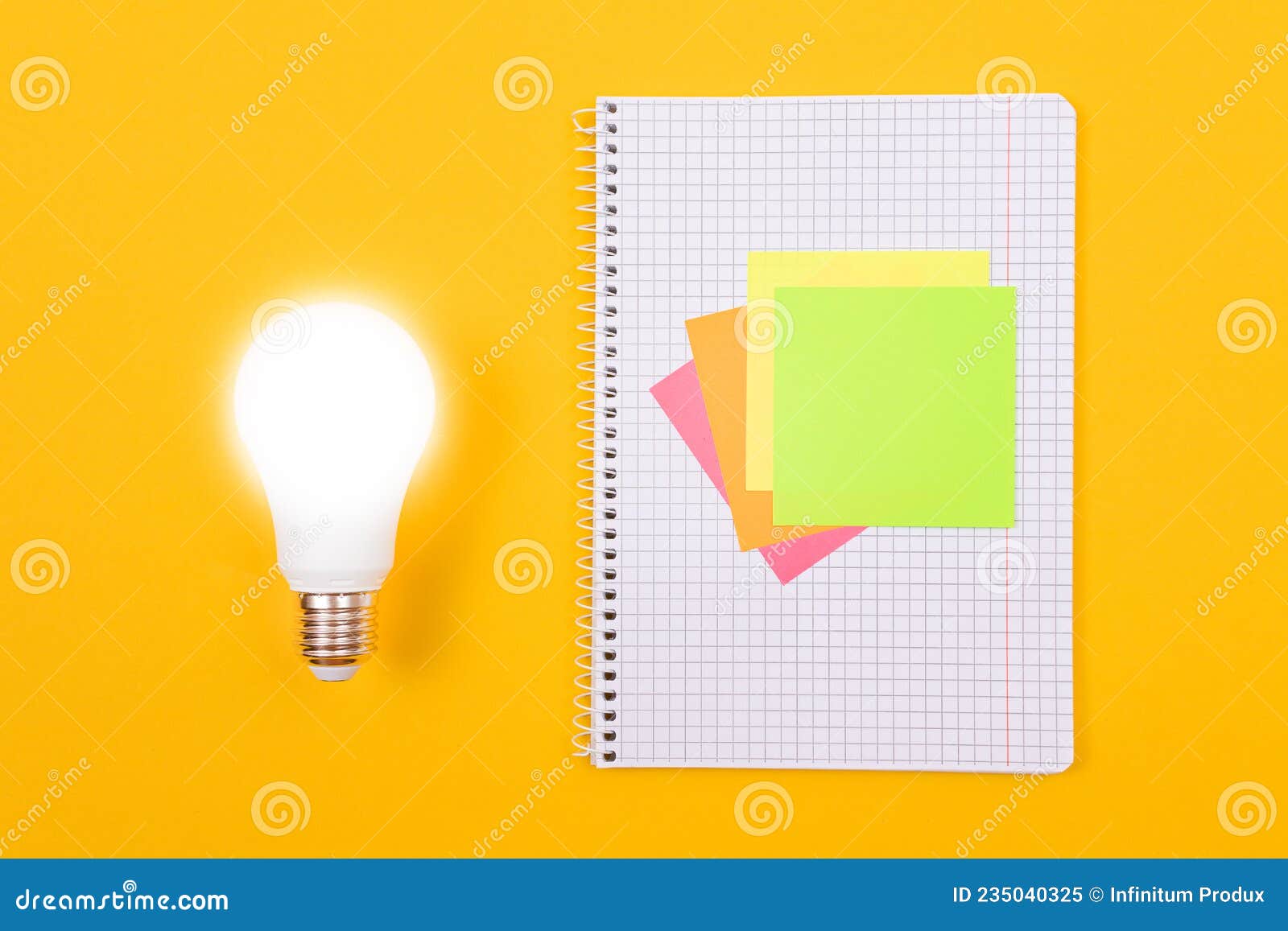 Glowing Power Saving Lamp and a Notepad with Sticky Notes Stock Image ...