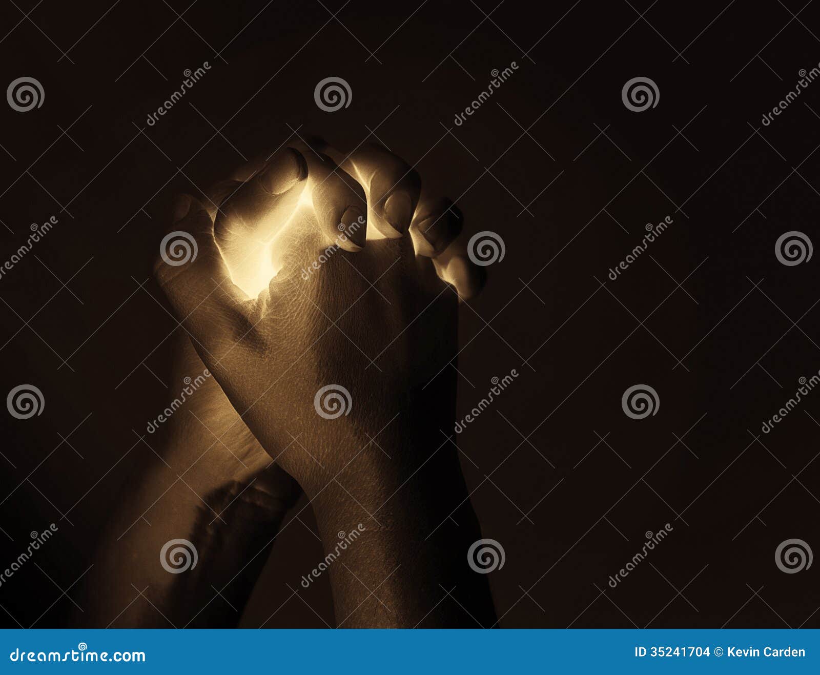 Glowing in praying hands stock photo. Image of orange - 35241704