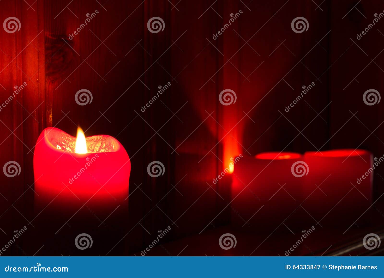 Glowing Red Candles stock image. Image of candlelit, candles - 64333847