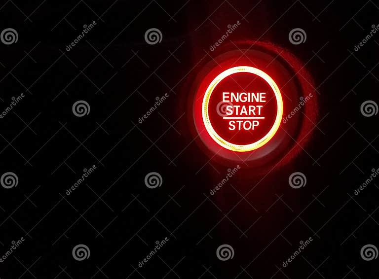 Glowing Red Engine Start Stop Light and Black Background Stock Photo ...