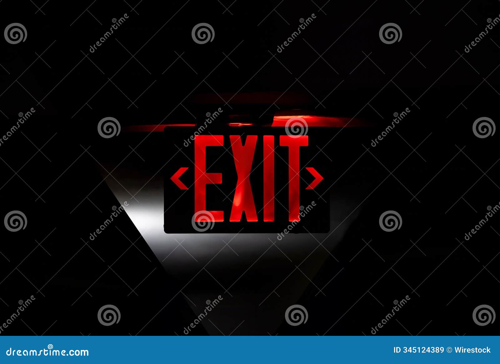 Glowing Red Exit Sign in a Dark Setting, Illuminated with Subtle Light ...