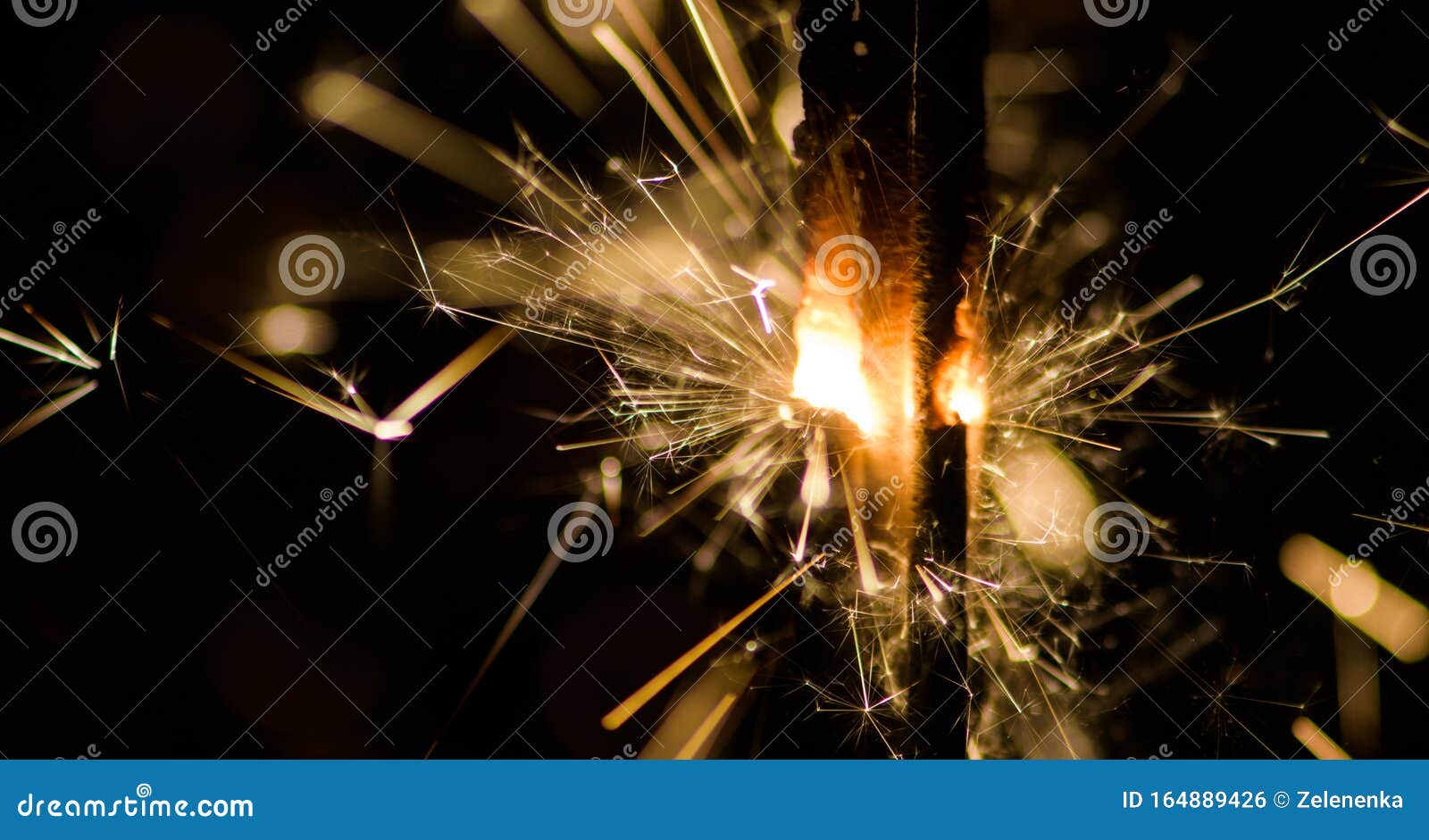 Glowing Sparks in the dark stock photo. Image of flame - 164889426