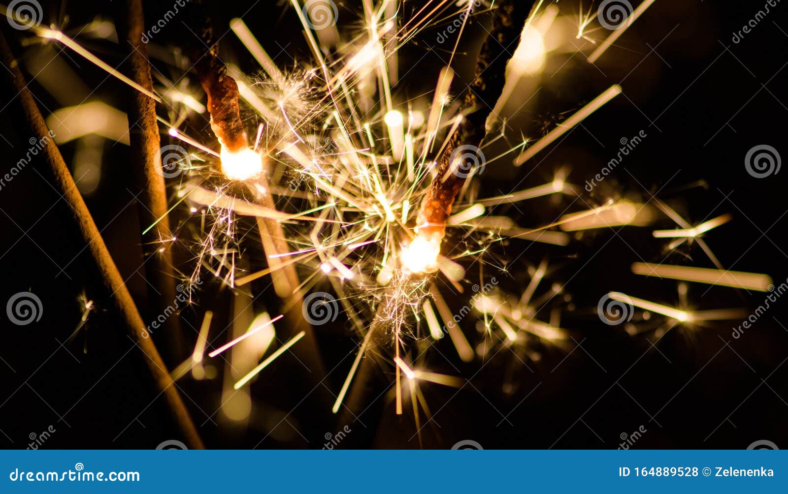 Glowing Sparks in the dark stock photo. Image of flash - 164889528