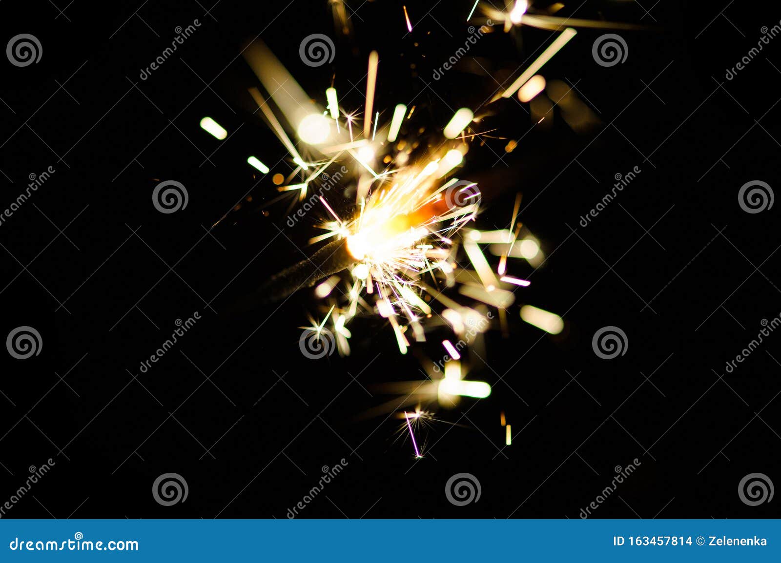 Glowing Sparks in the dark stock photo. Image of sparks - 163457814
