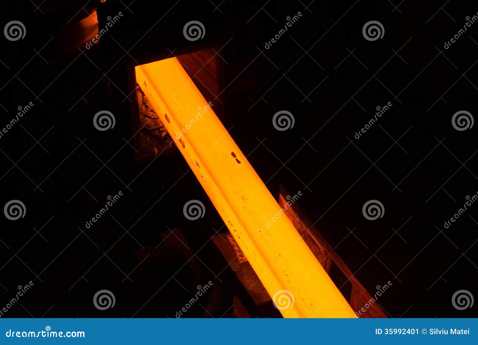 Glowing steel bar stock image. Image of industry, intense - 35992401