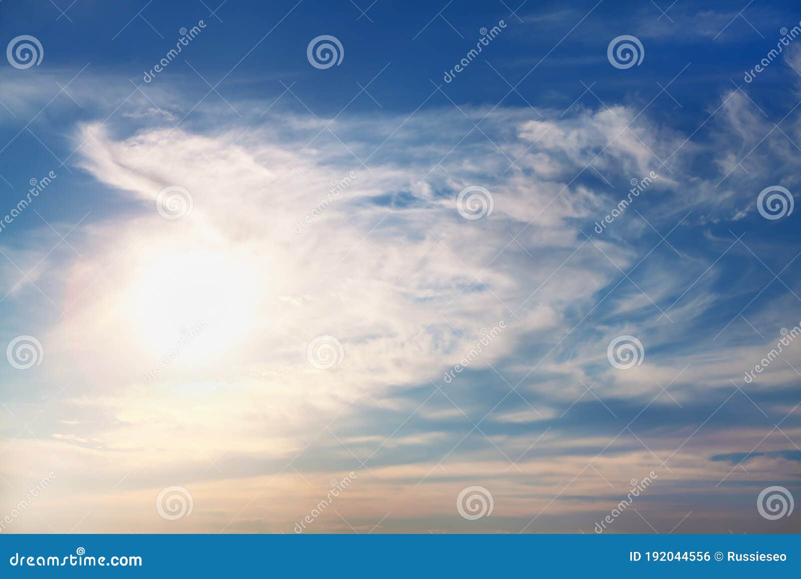 Glowing sun in hazy clouds stock photo. Image of landscape - 192044556